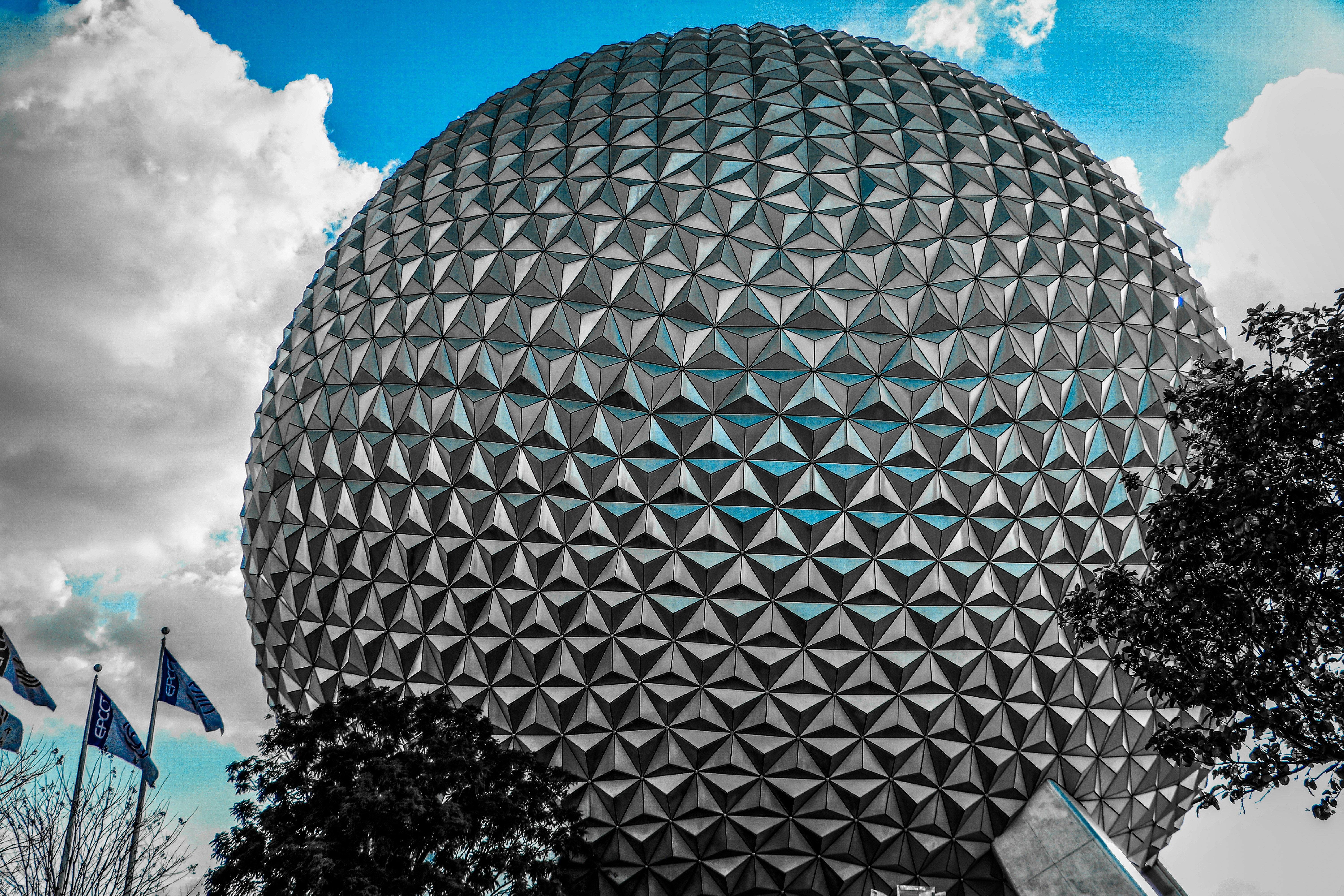 Geometric Sphere: A Faceted Giant Rising Above the Trees