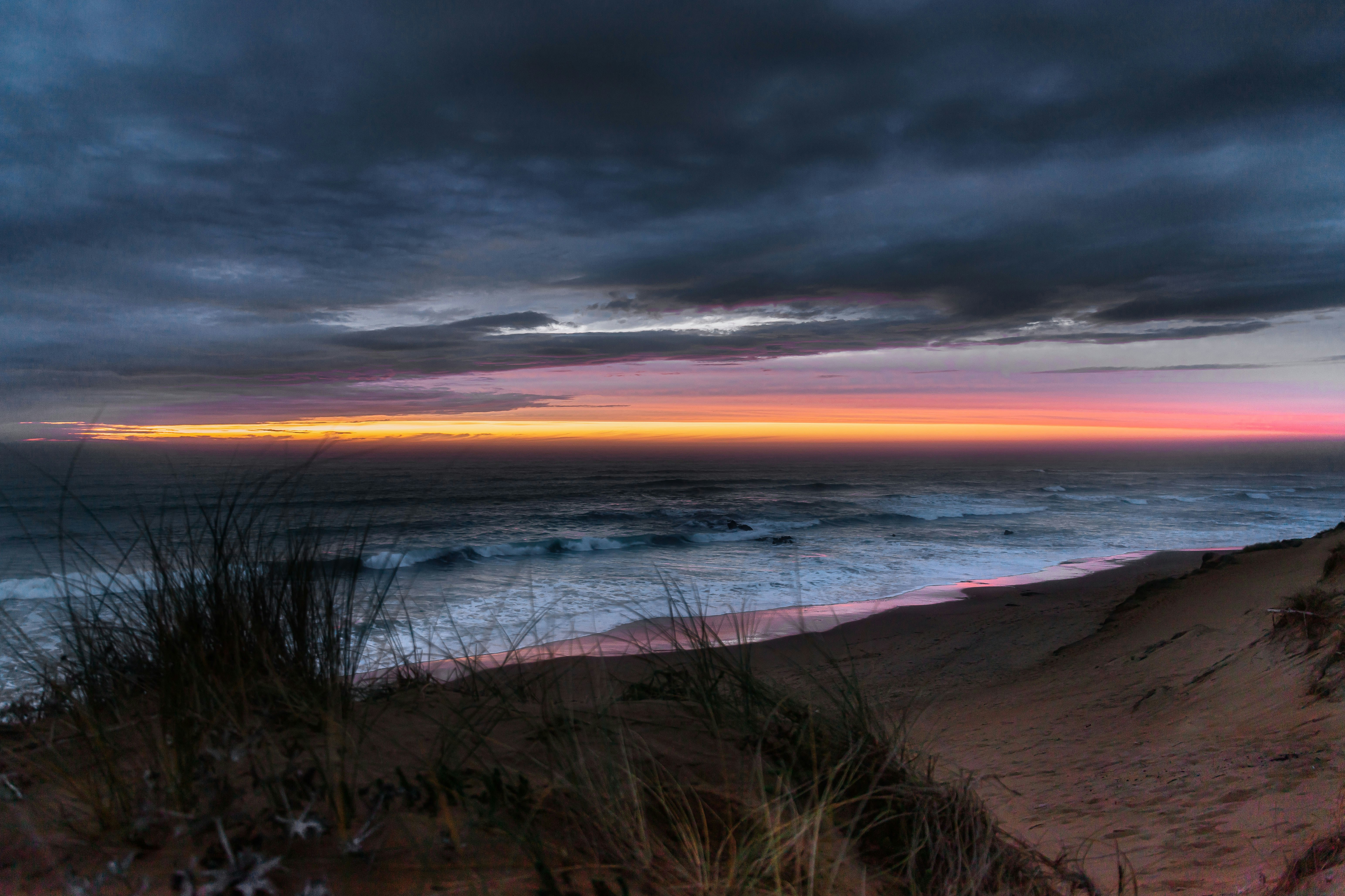 A view of the ocean from a beach at sunset photo – Free Nature Image on ...