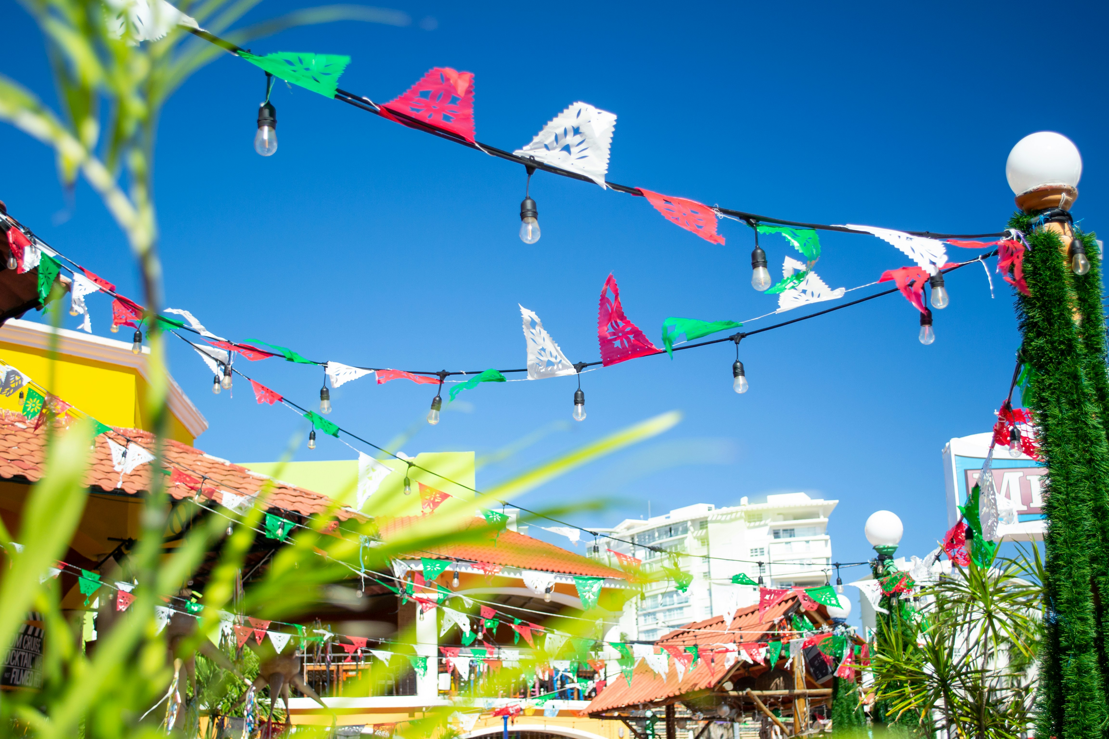 A bunch of colorful flags hanging from a line photo – Free Мексика ...
