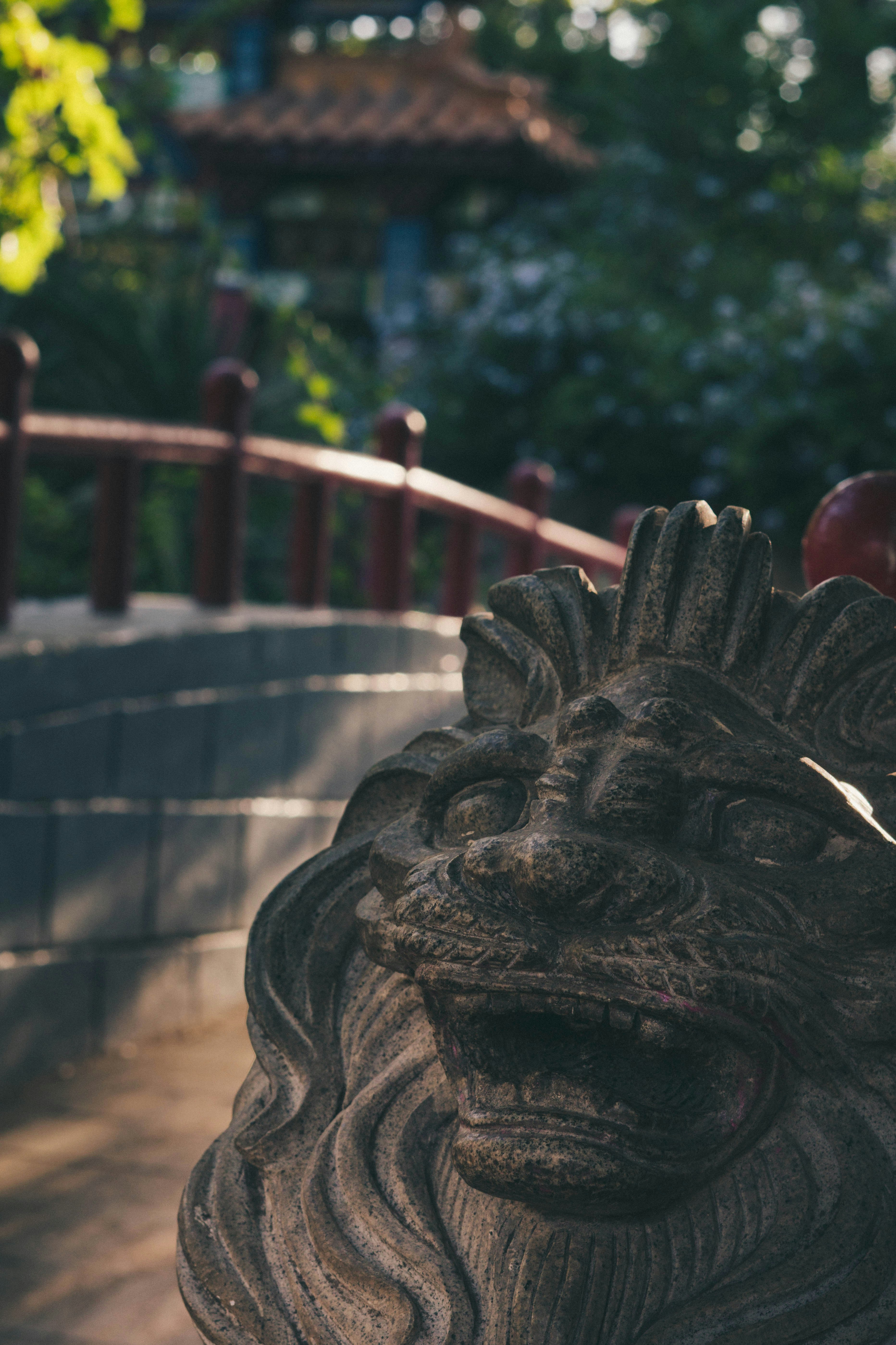 a statue of a lion with its mouth open