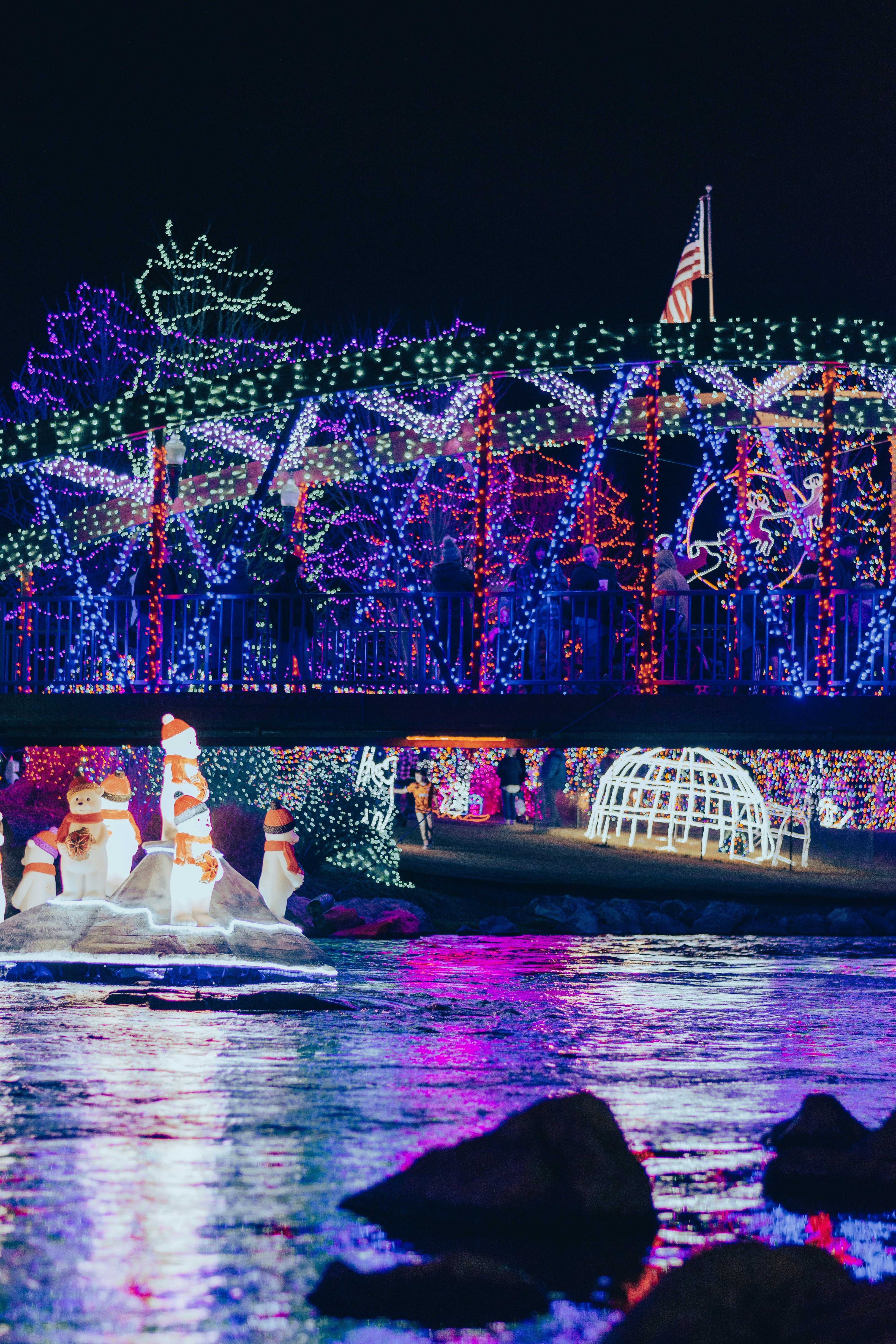 Neon Reflections Over the Winter River: A Night of Floating Lights