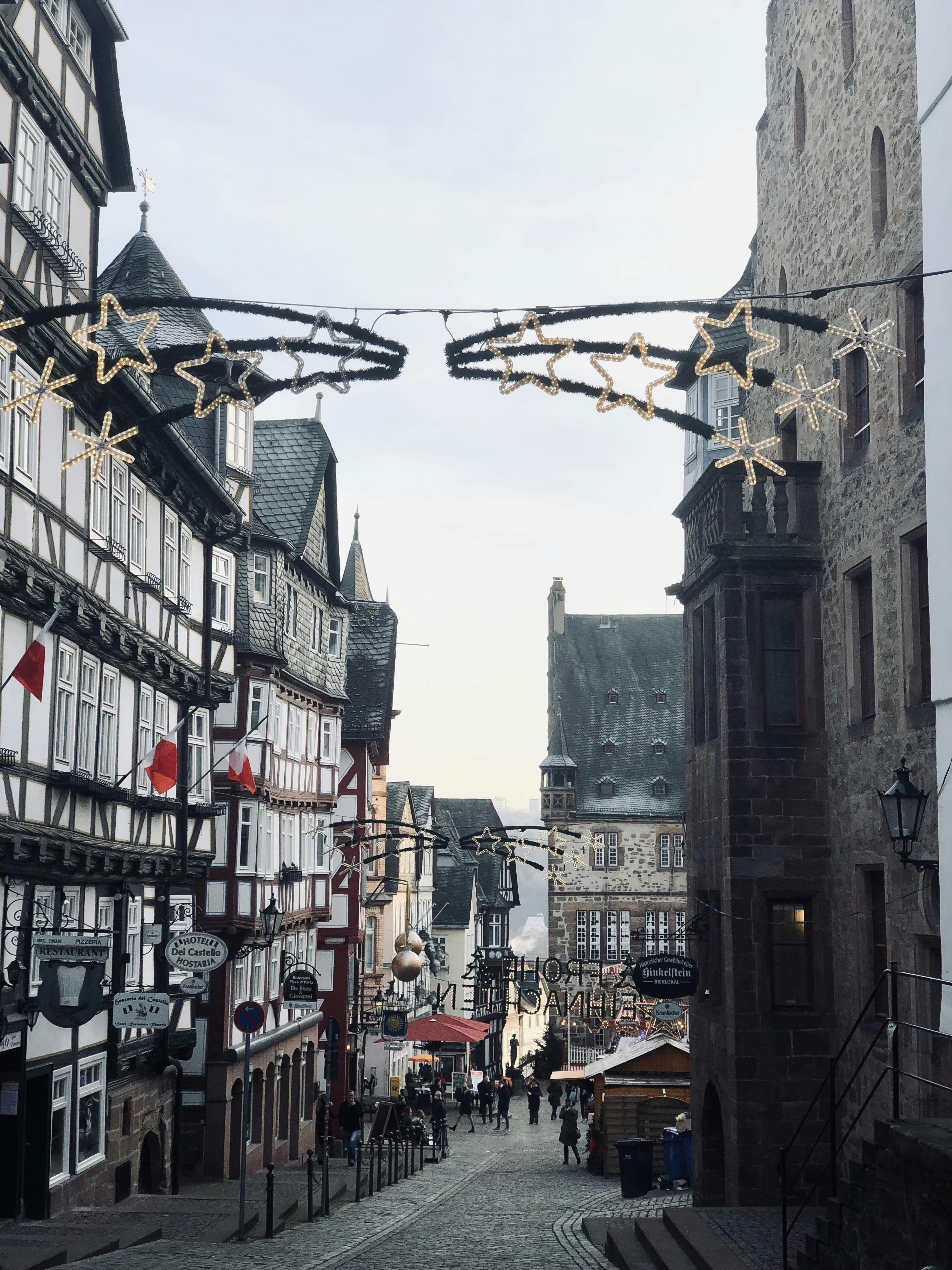 A city street with a bunch of buildings photo – Free Marburg Image on ...