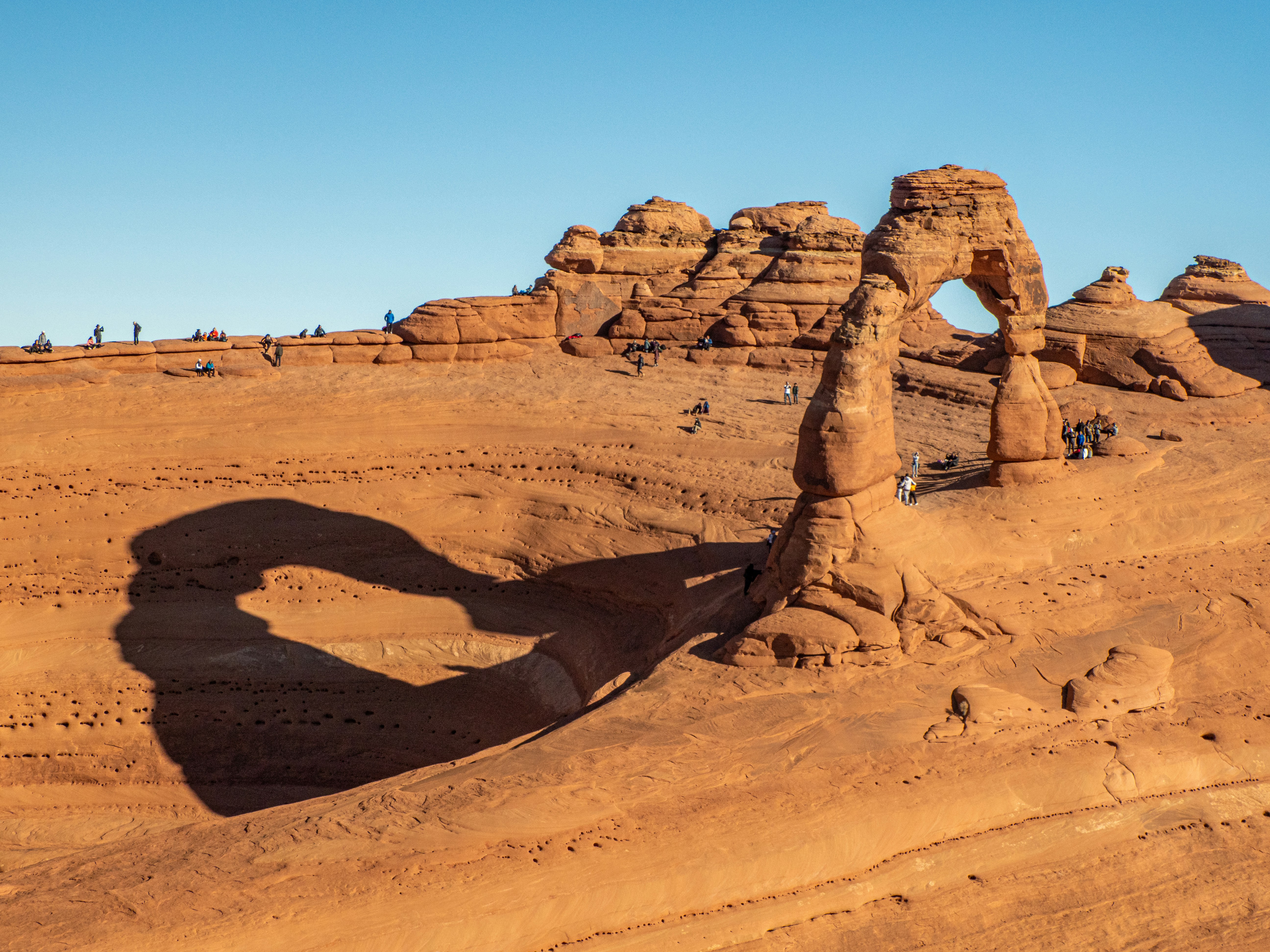 The shadow of a rock formation in the desert photo – Free Blue Image on ...