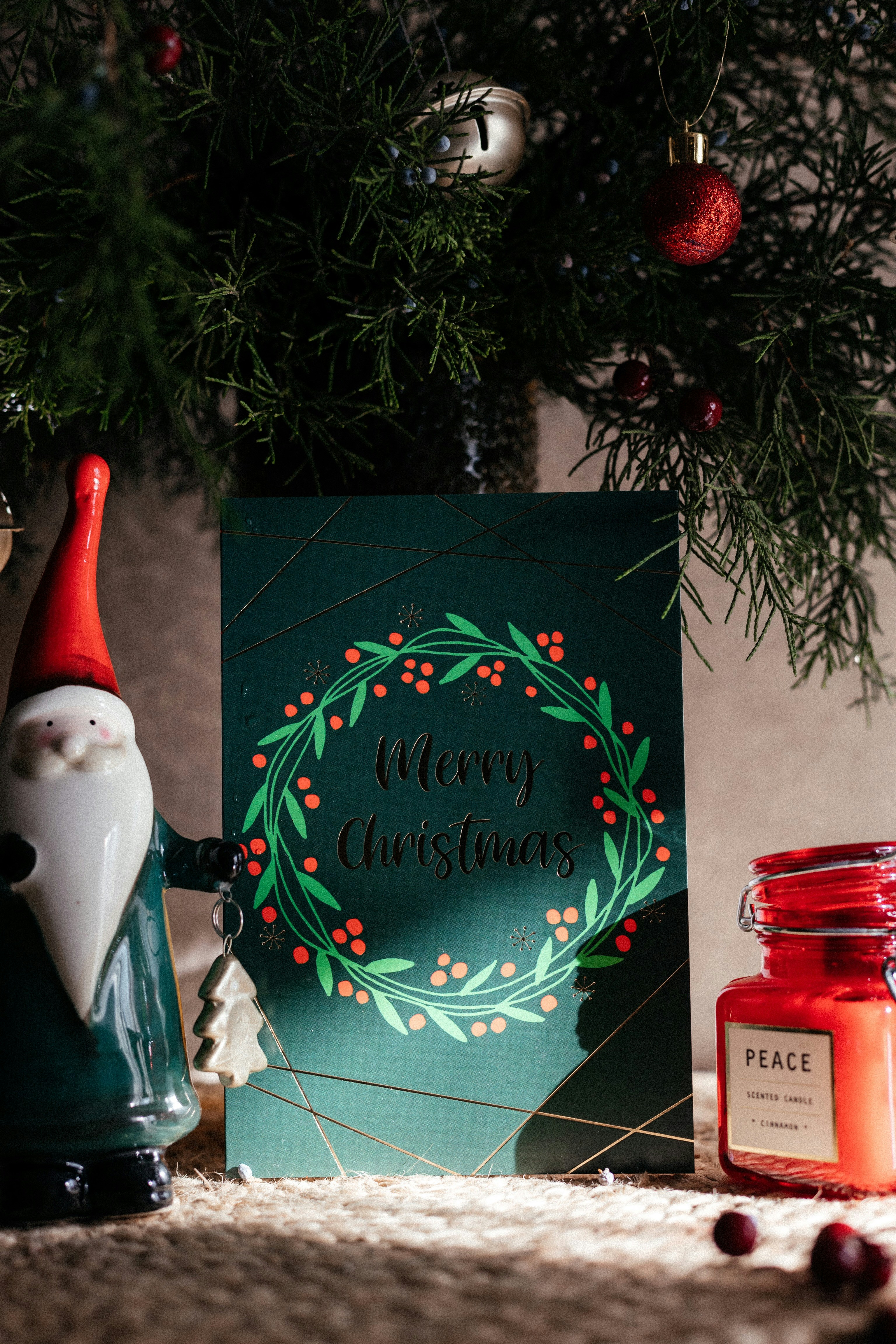 A festive Christmas Card Glow Beside a Cozy Jar