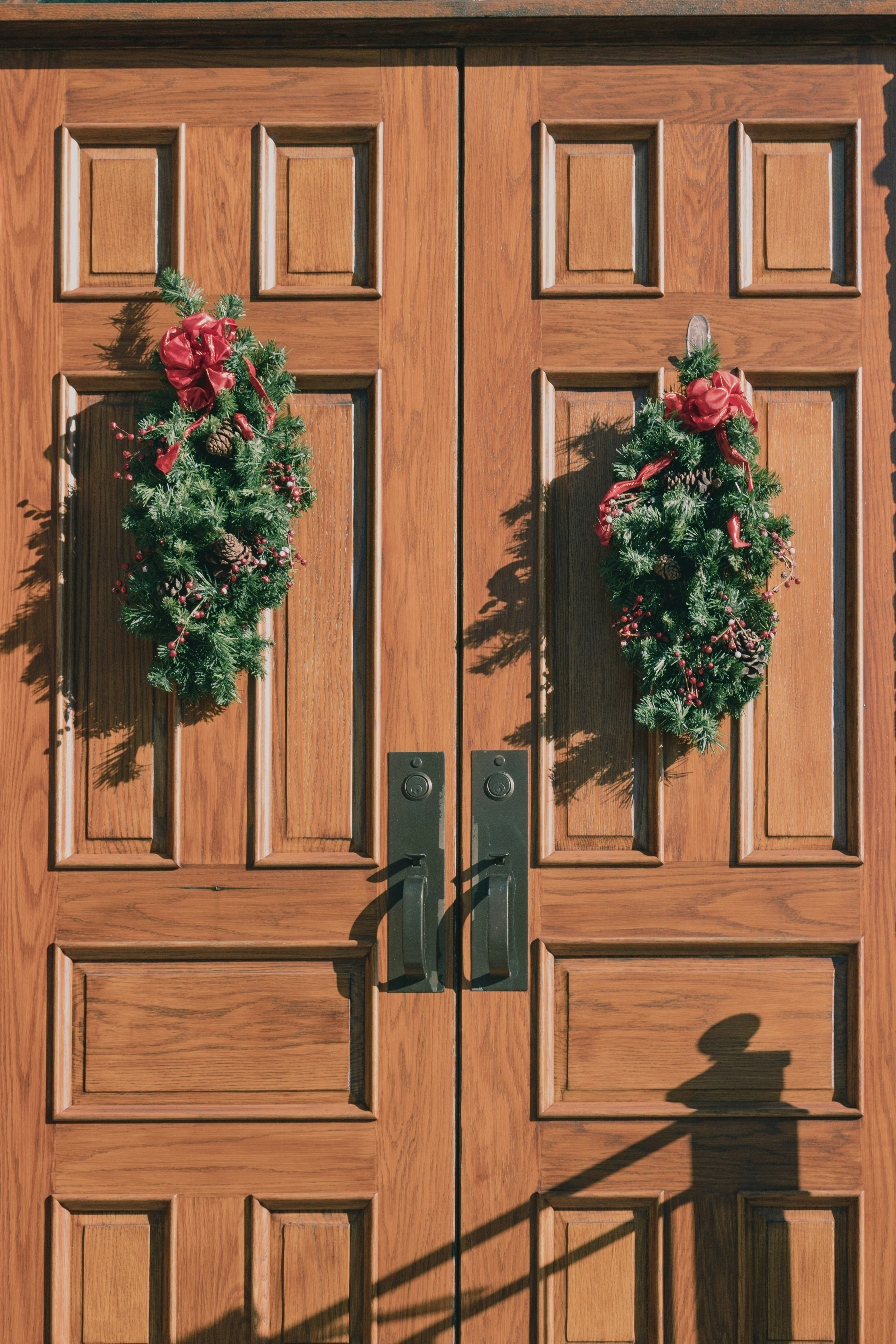 Two Festive Wreaths Gracing a Double Door