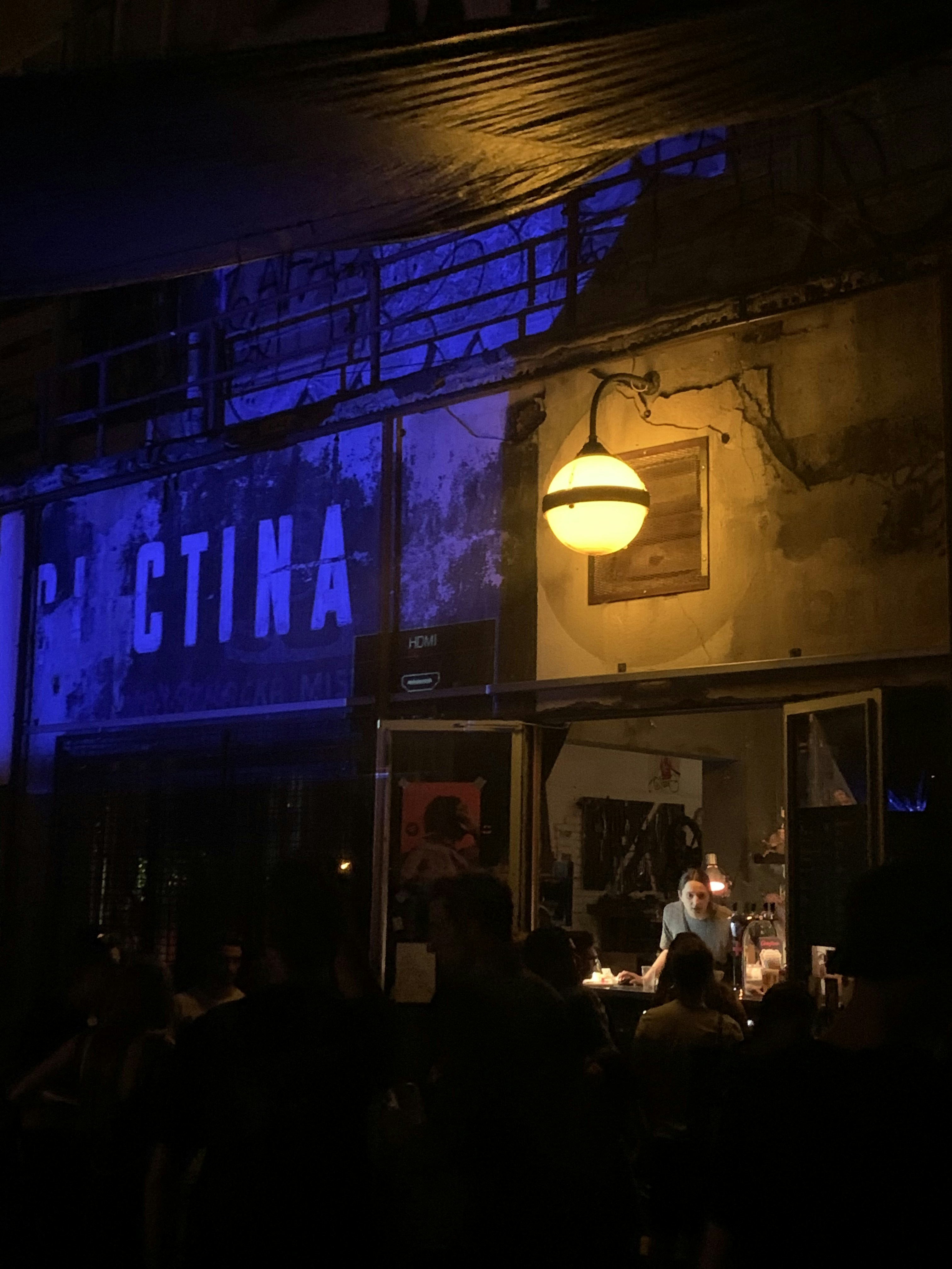 Antika Bar at Night: Blue Facade Meets Warm Lantern