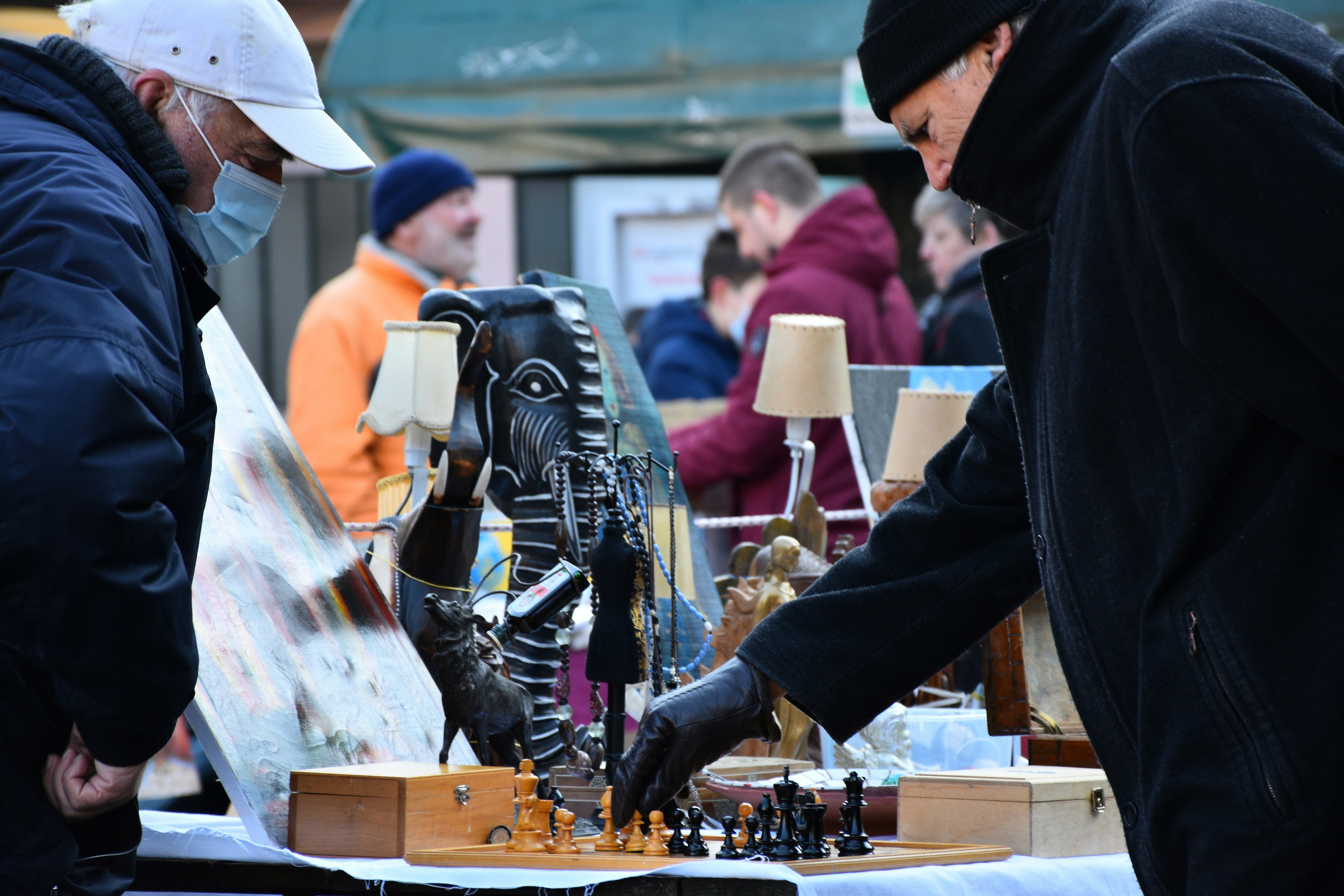 Stallside Strategy: Chess at a Bustling Market