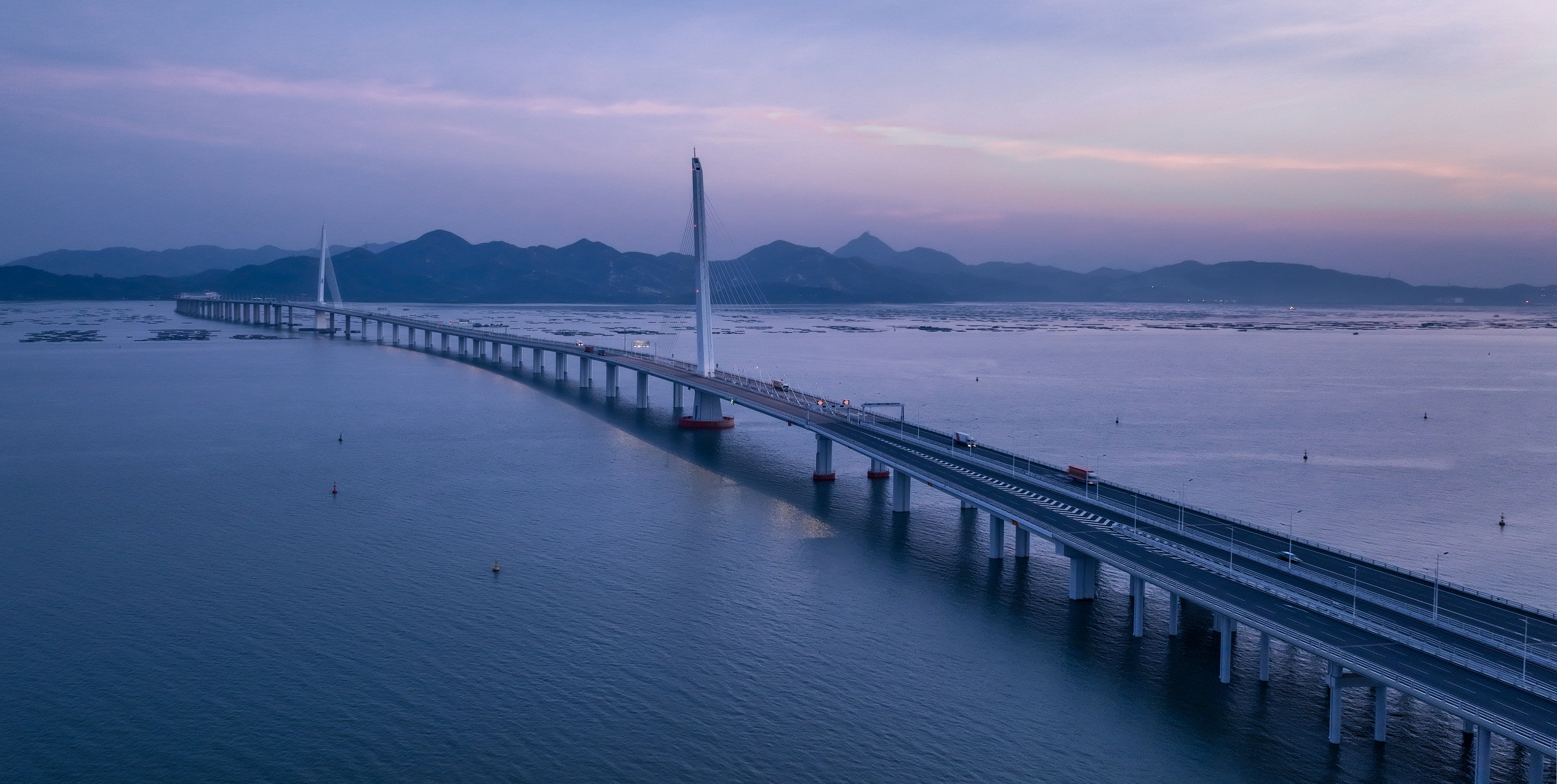 A long bridge over a large body of water photo – Free China Image on ...