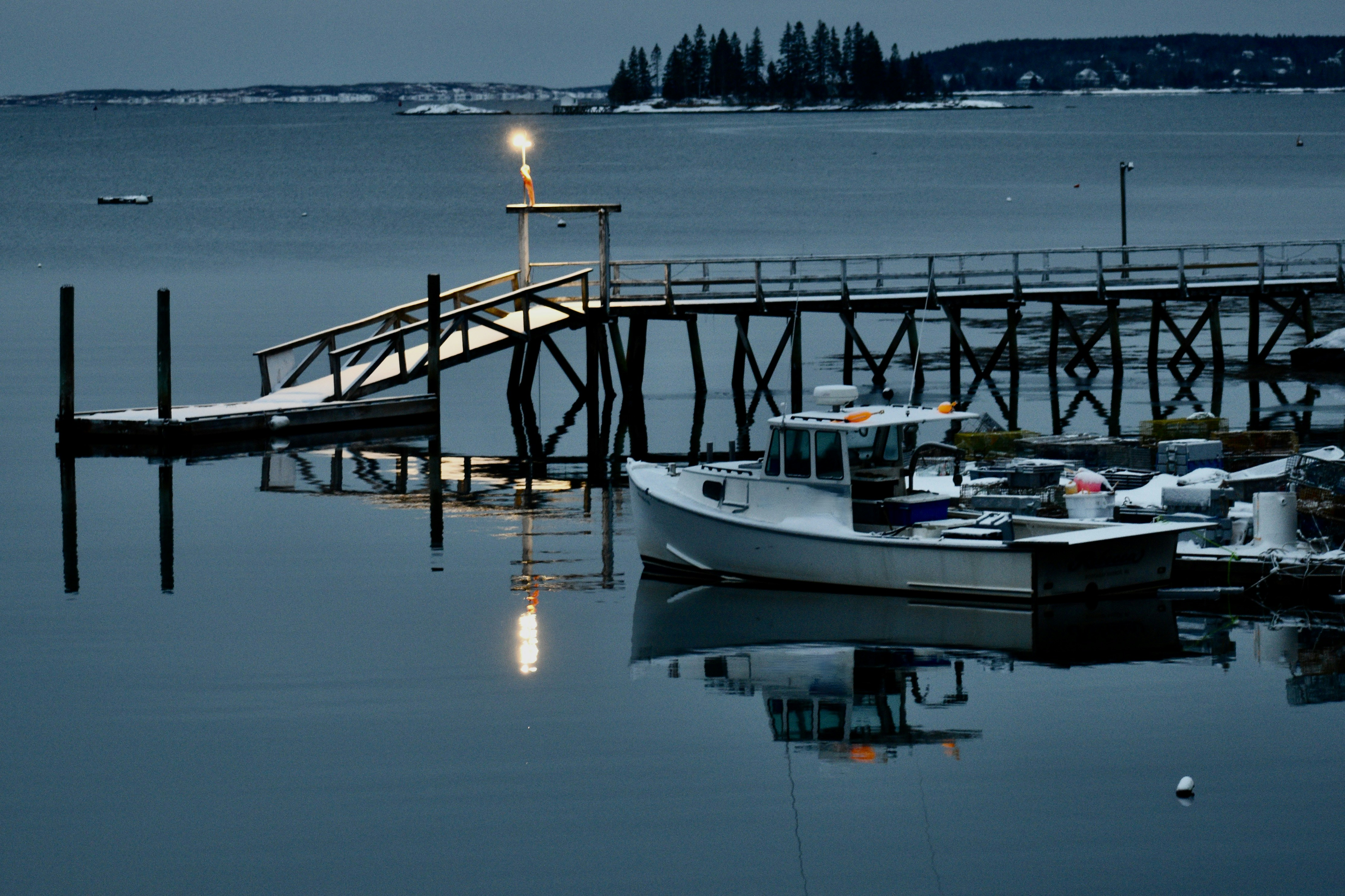 Blue Hour Docklight: Lantern, Boat, and Quiet Reflections