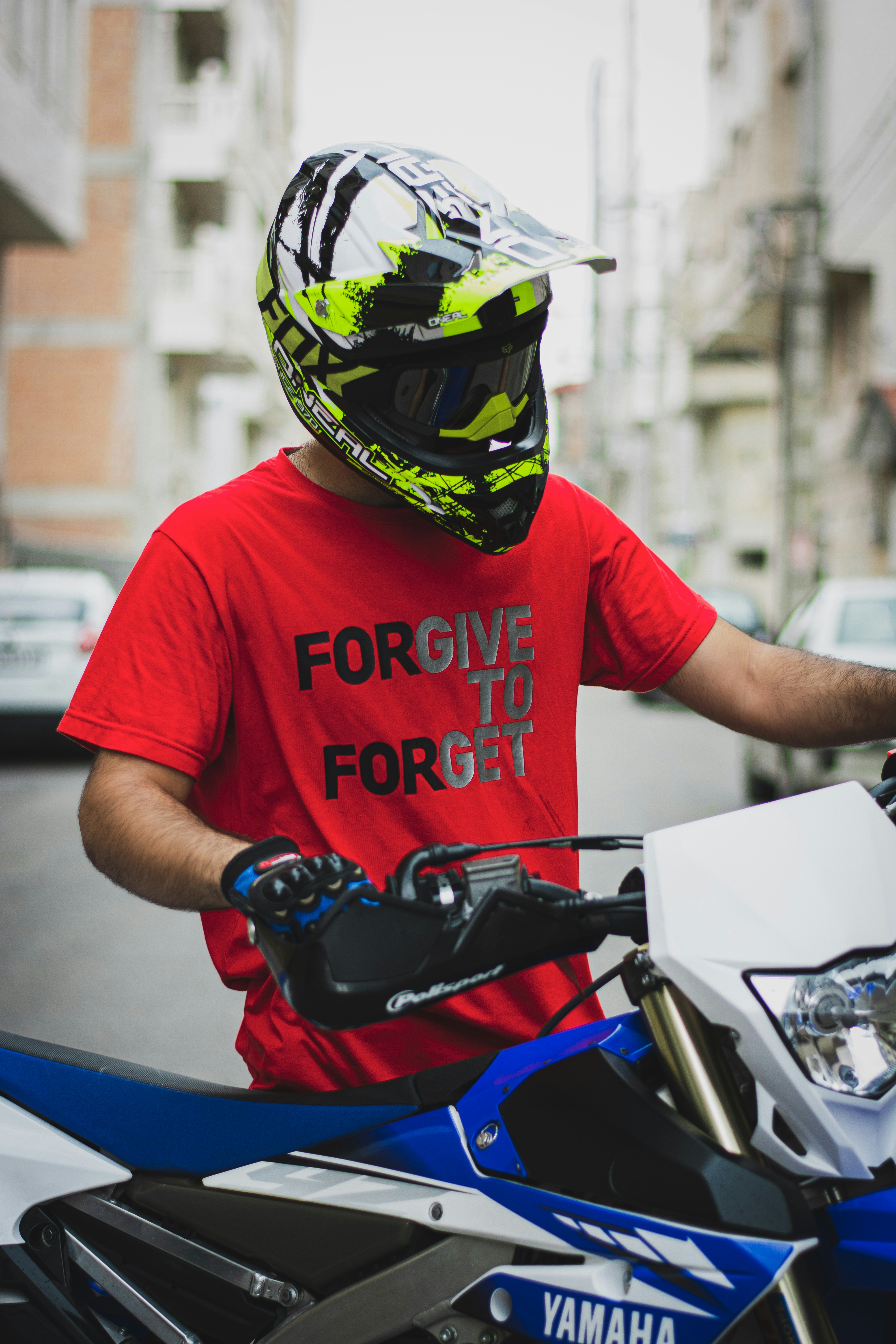 A man wearing a helmet and gloves on a motorcycle photo – Free Iran ...