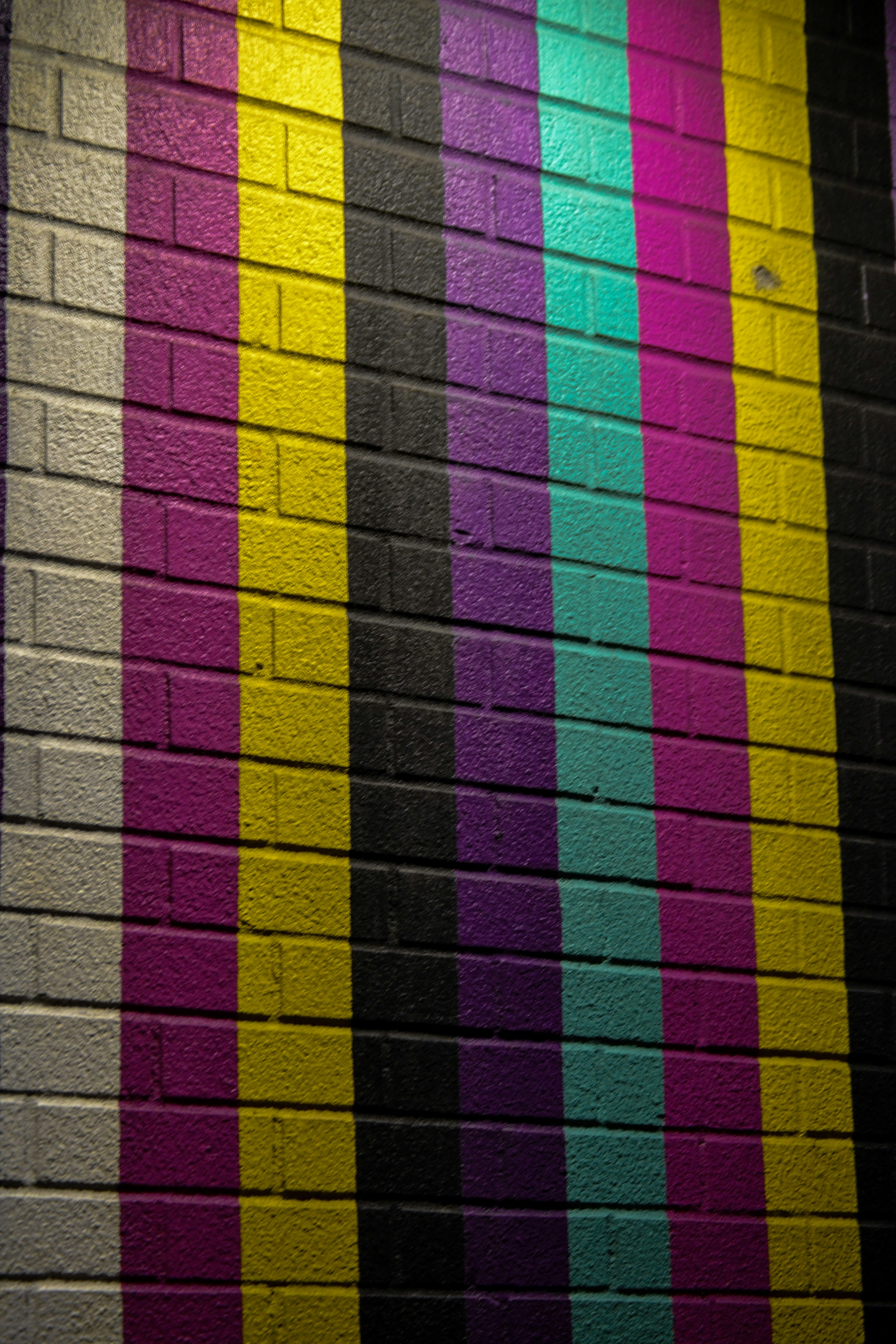 A brick wall painted with multicolored stripes photo – Free New york ...