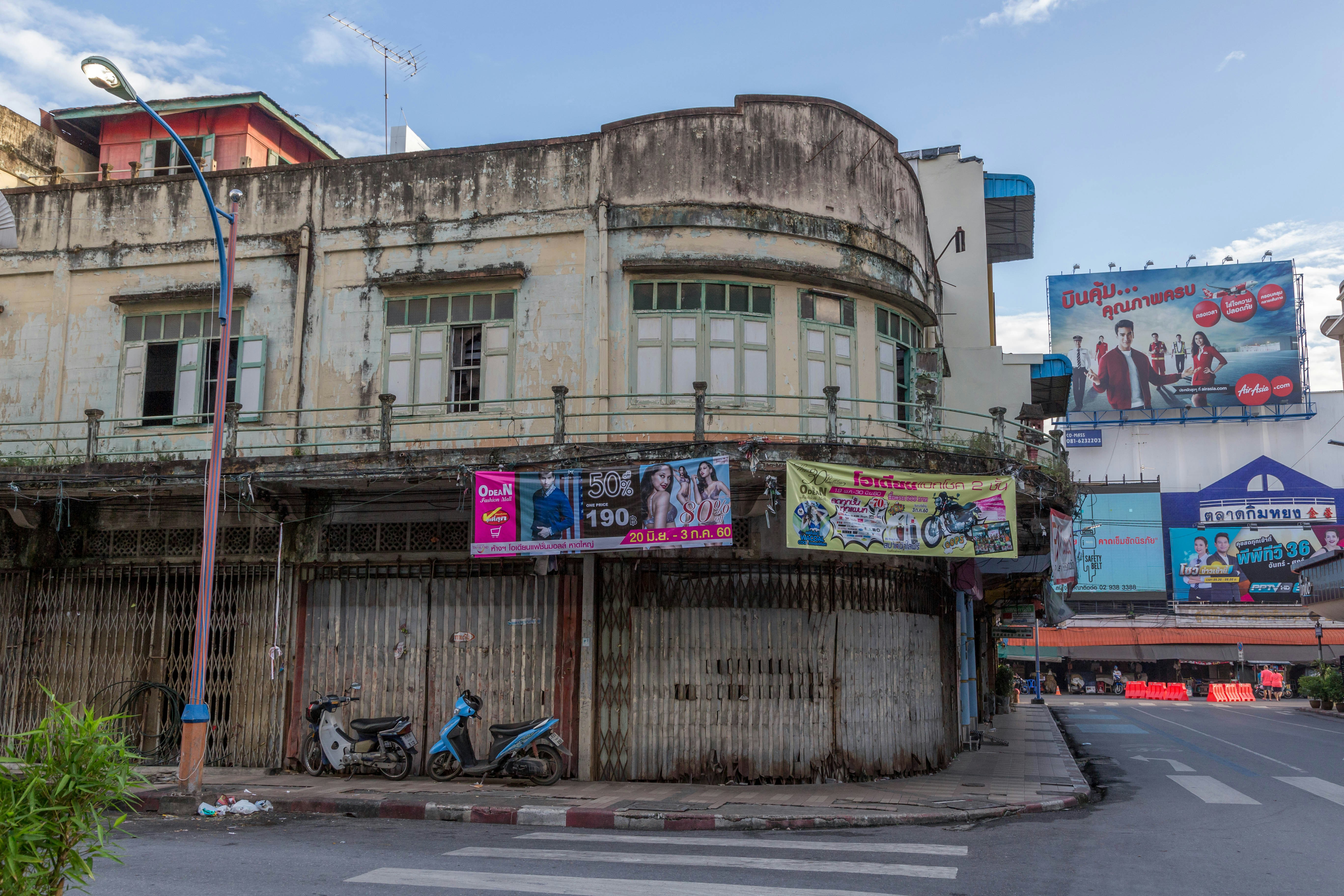 an old building with a lot of signs on it