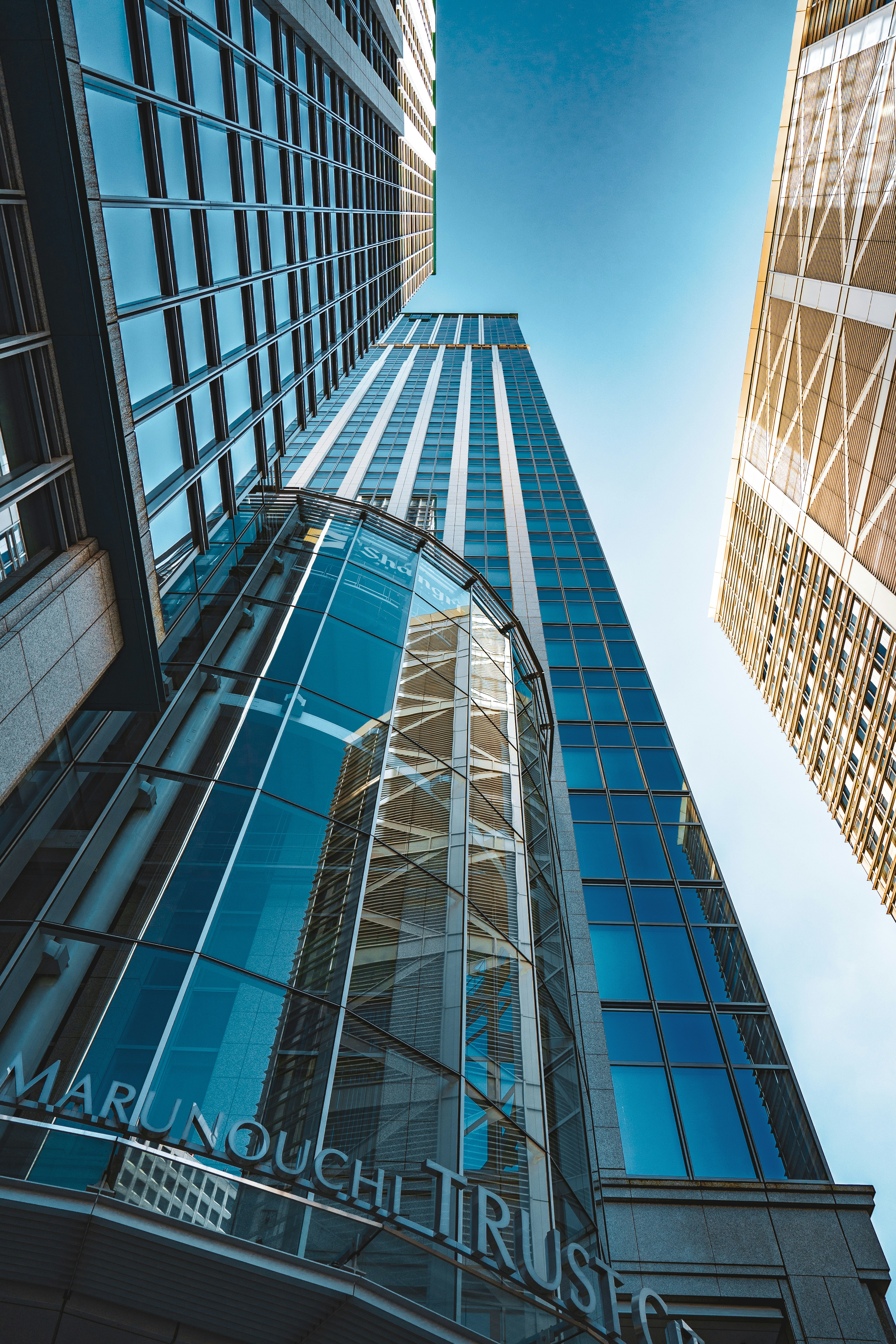 A very tall building with a very tall sign on it's side photo – Free ...