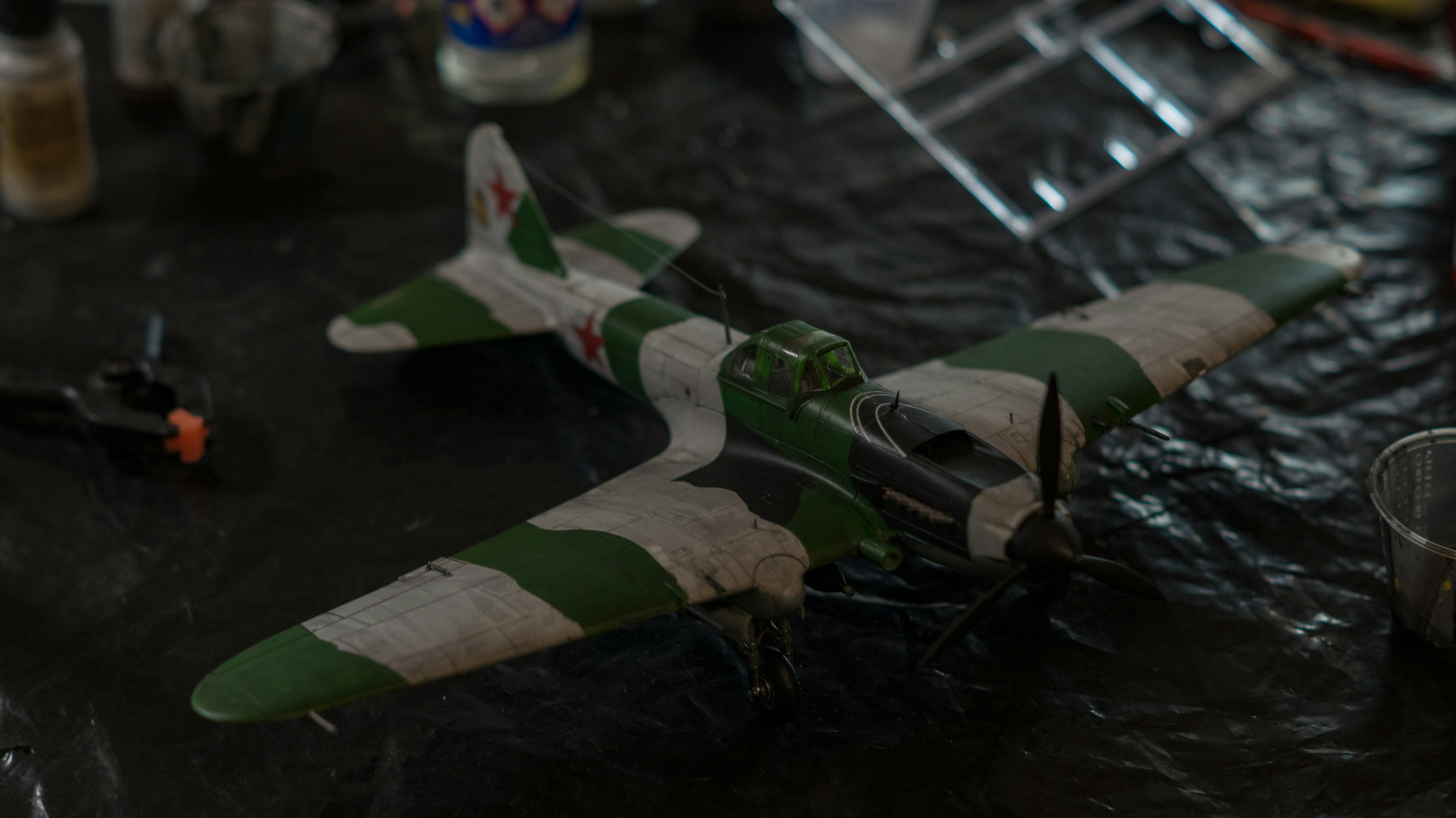 A green and white model airplane on a table photo – Free Soviet Image ...