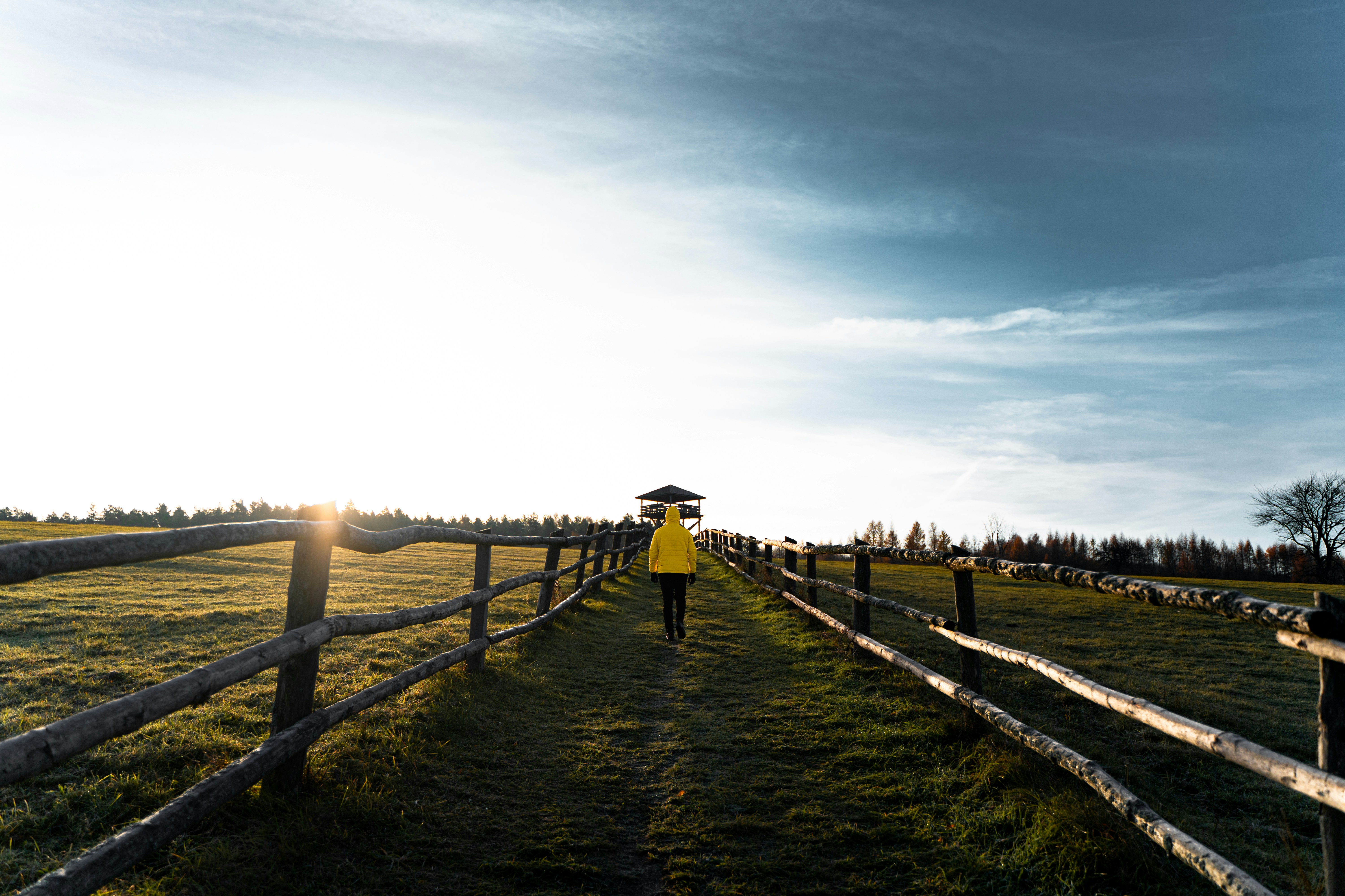 Yellow Beacon on a Long Fenced Path
