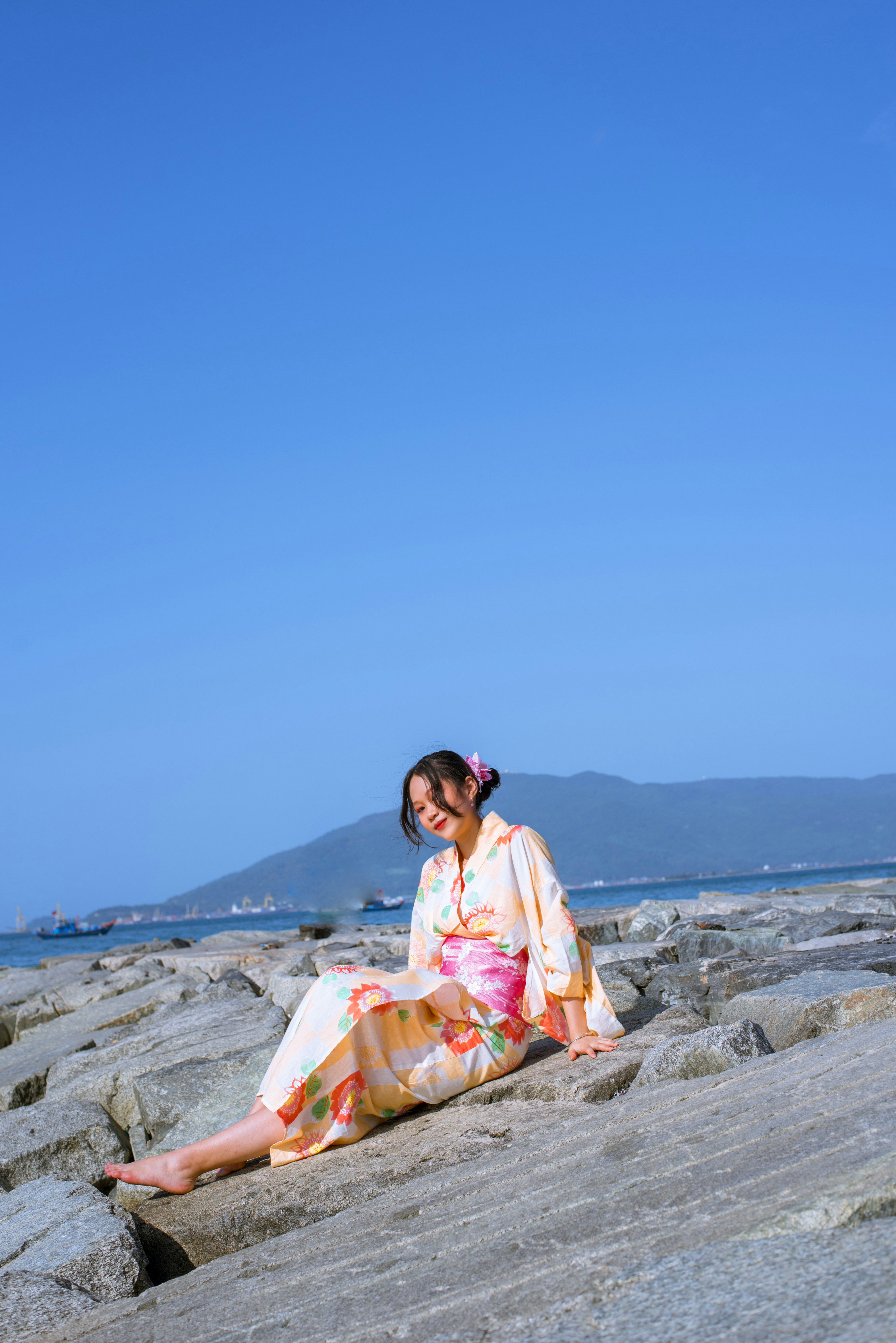 Azure Silence: A Kimono Portrait on the Rocky Seawall
