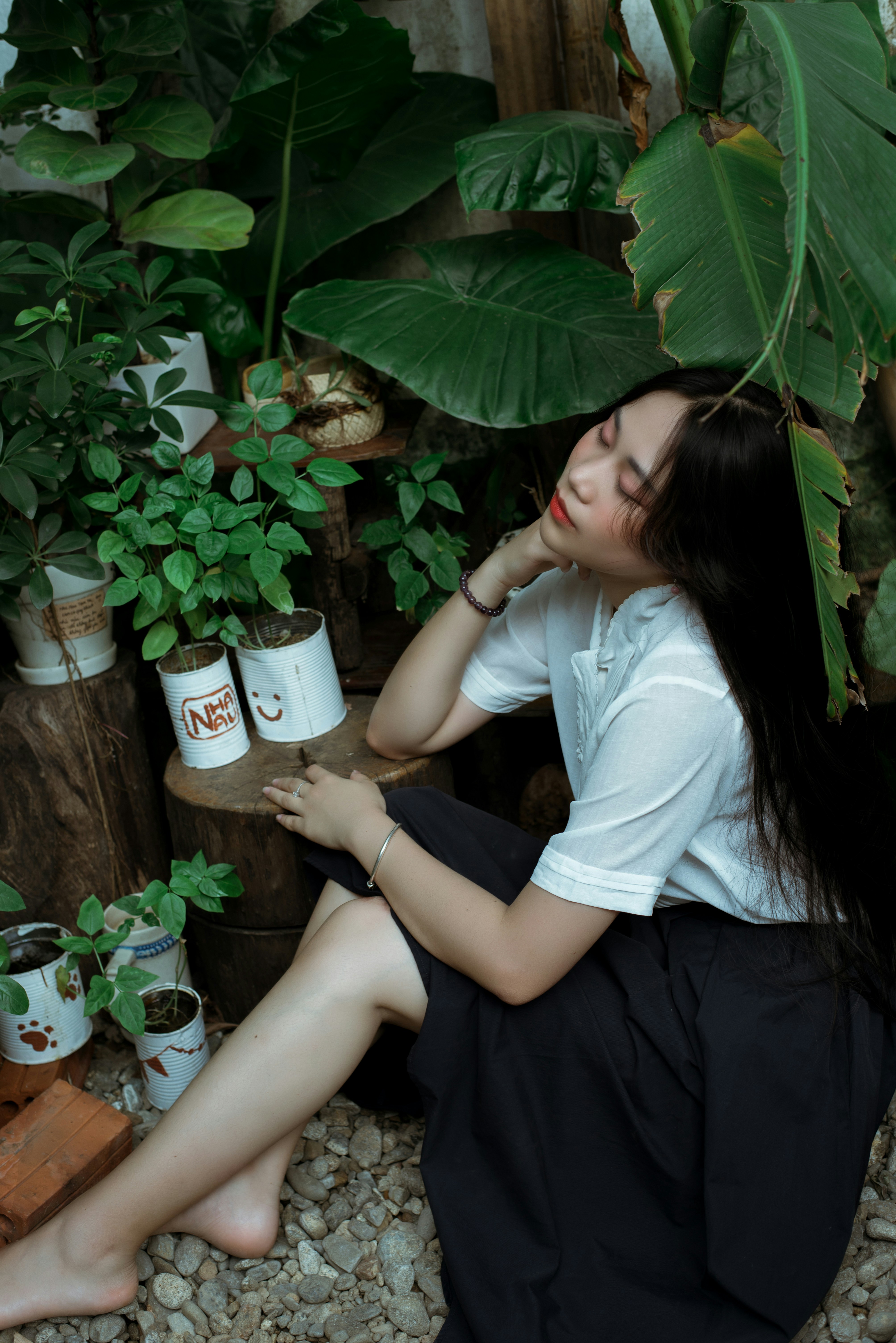Scented solace among leaves: a sunlit portrait in a leafy corner