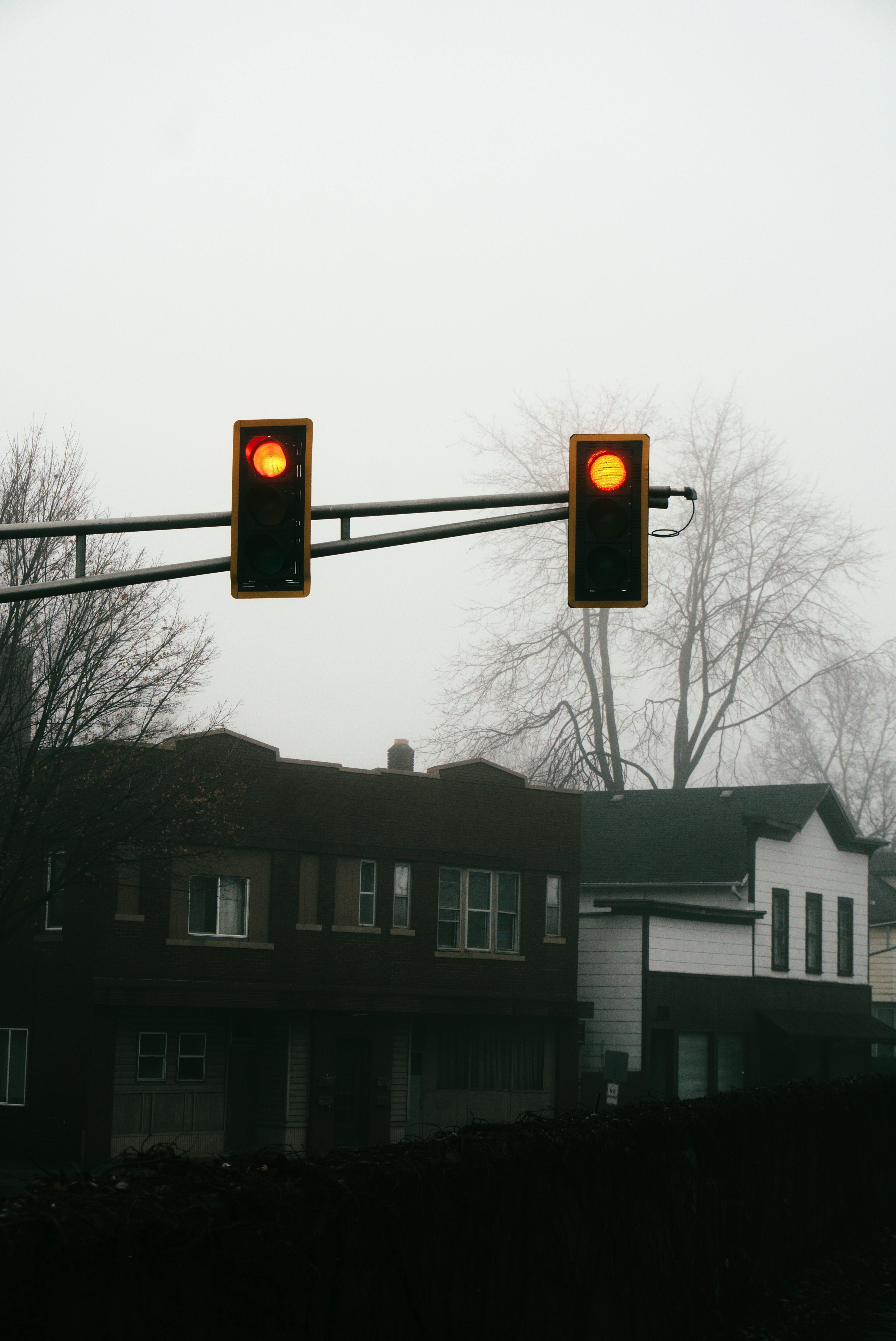 A traffic light hanging over a city street photo – Free Grey Image on ...