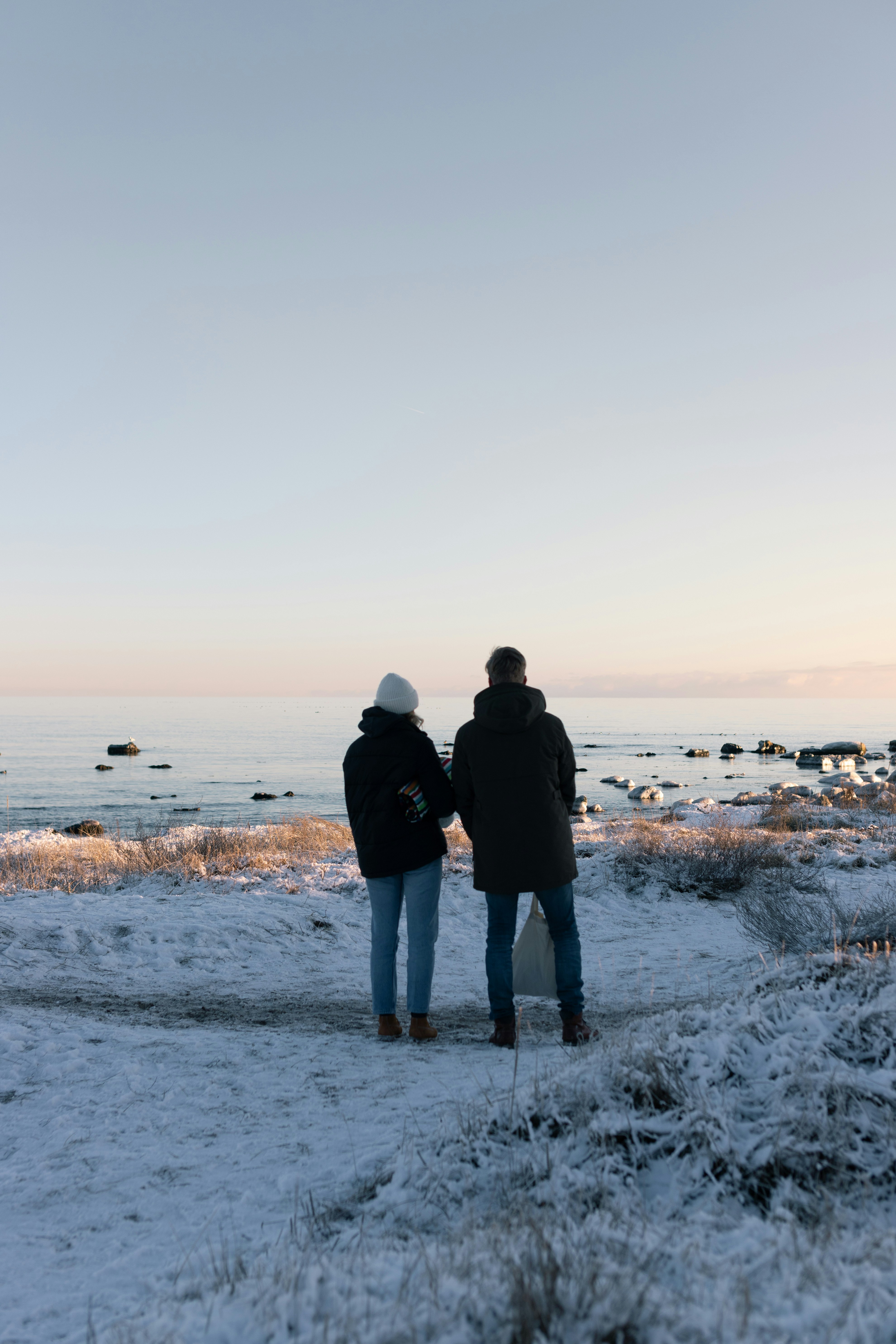 Winter shoreline embrace at sunset