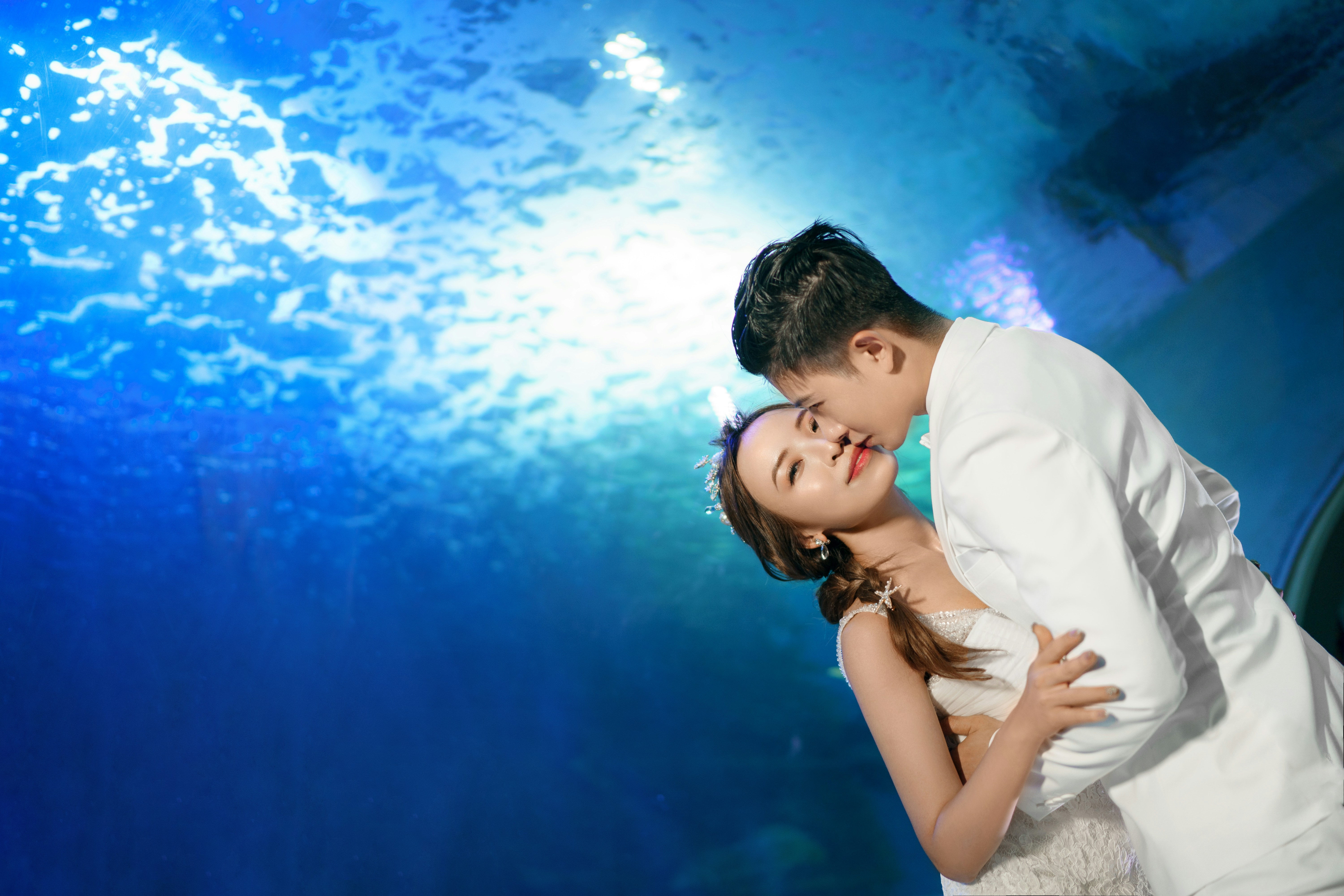 Underwater Embrace: A Quiet Moment in Blue Light