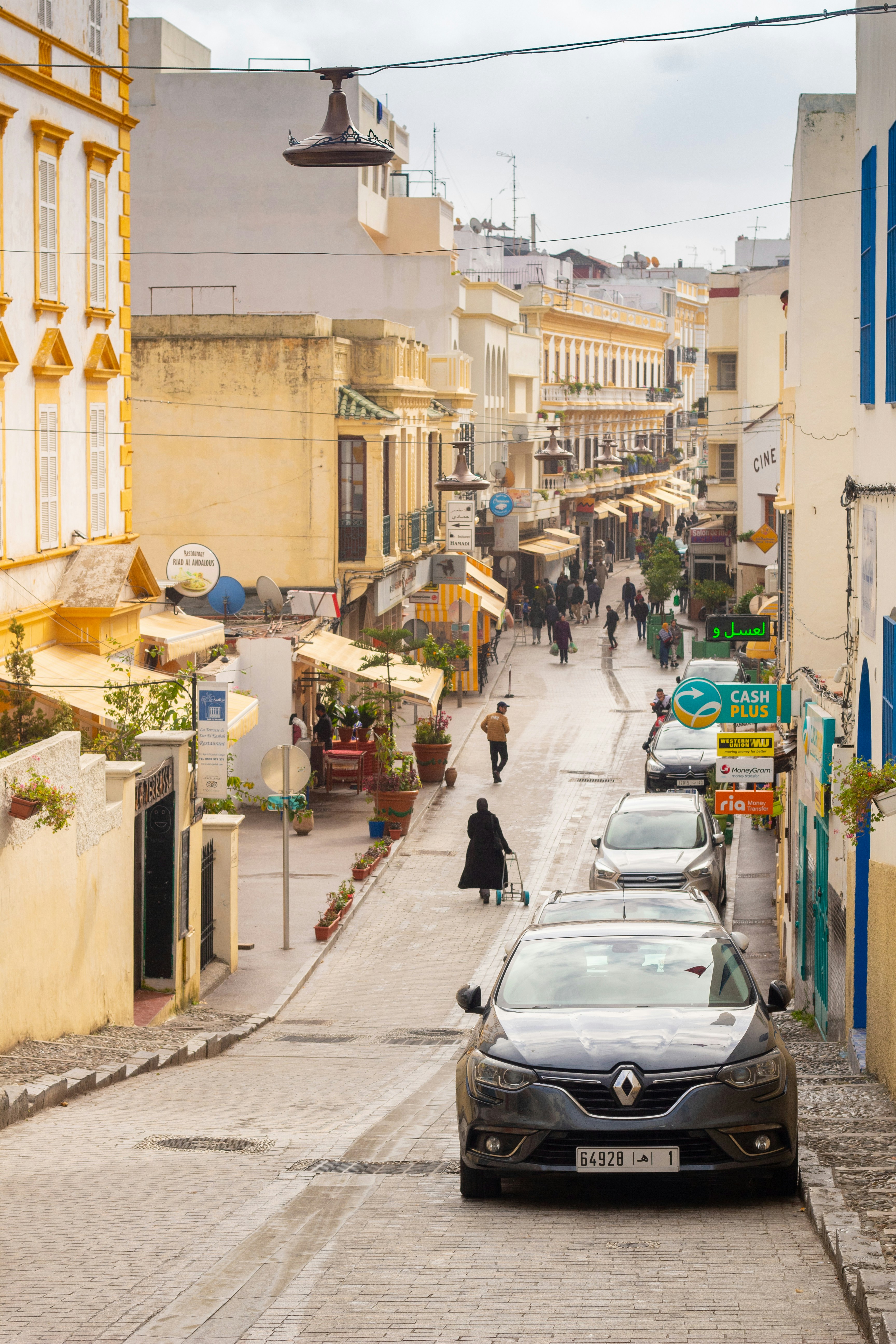 A car is parked on the side of the road photo – Free Tanger Image on ...