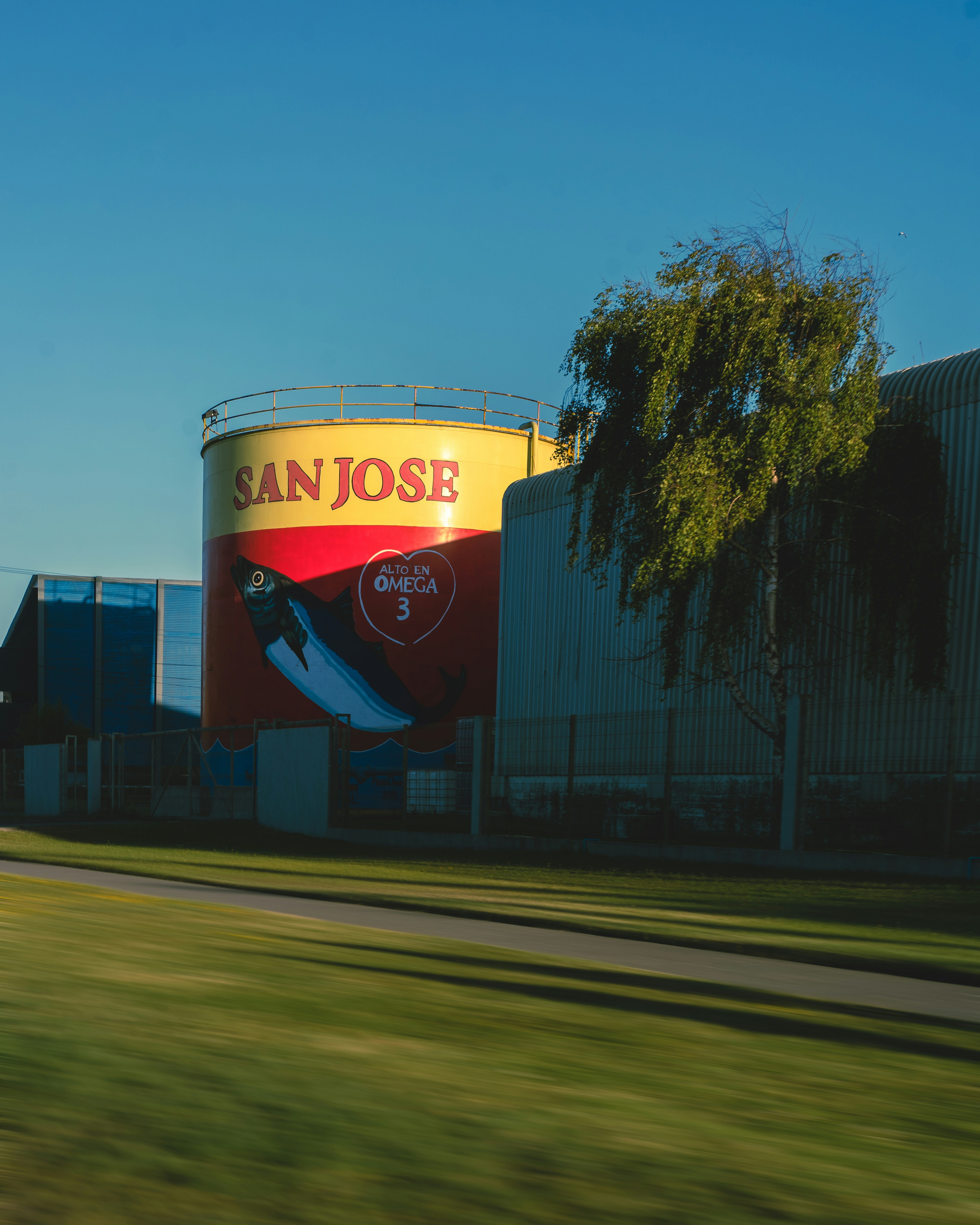 Sunlit Industrial Landscape with Iconic San Jose Tank