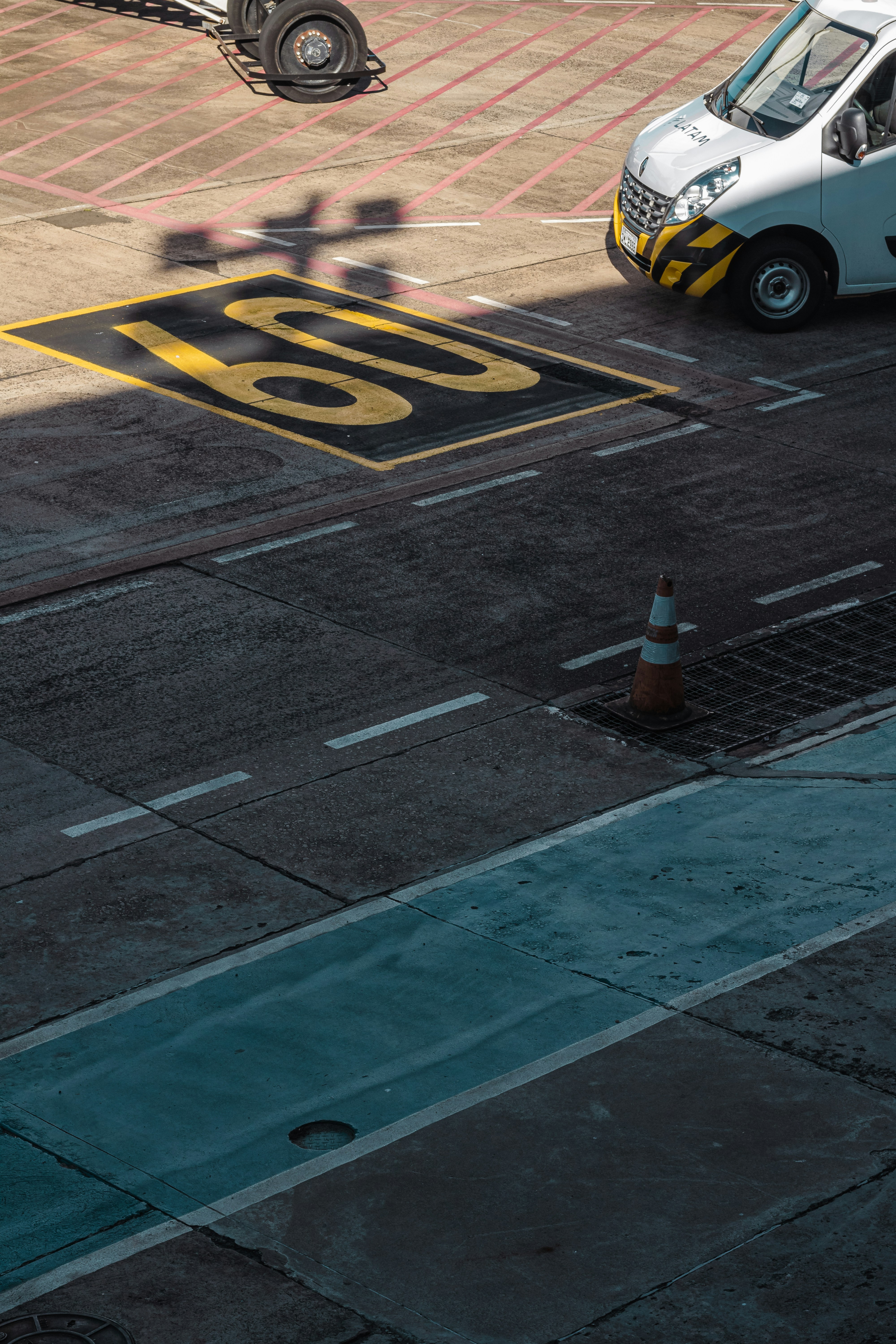 Shadow of the Runway: A Ground-Level Moment Under Yellow Markings