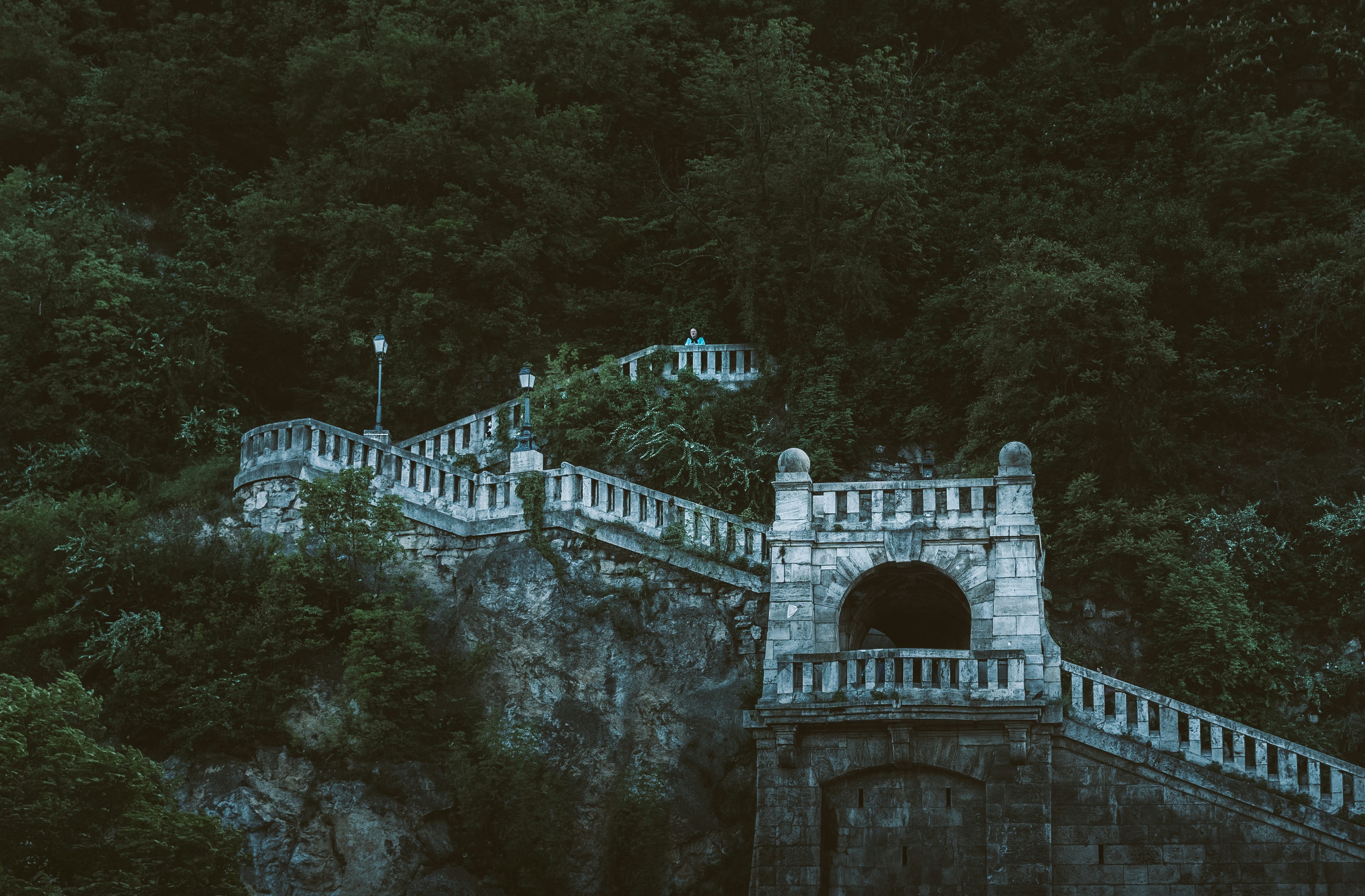 Blue Hour Terrace: A Stone Staircase Clinging to a Forested Cliff