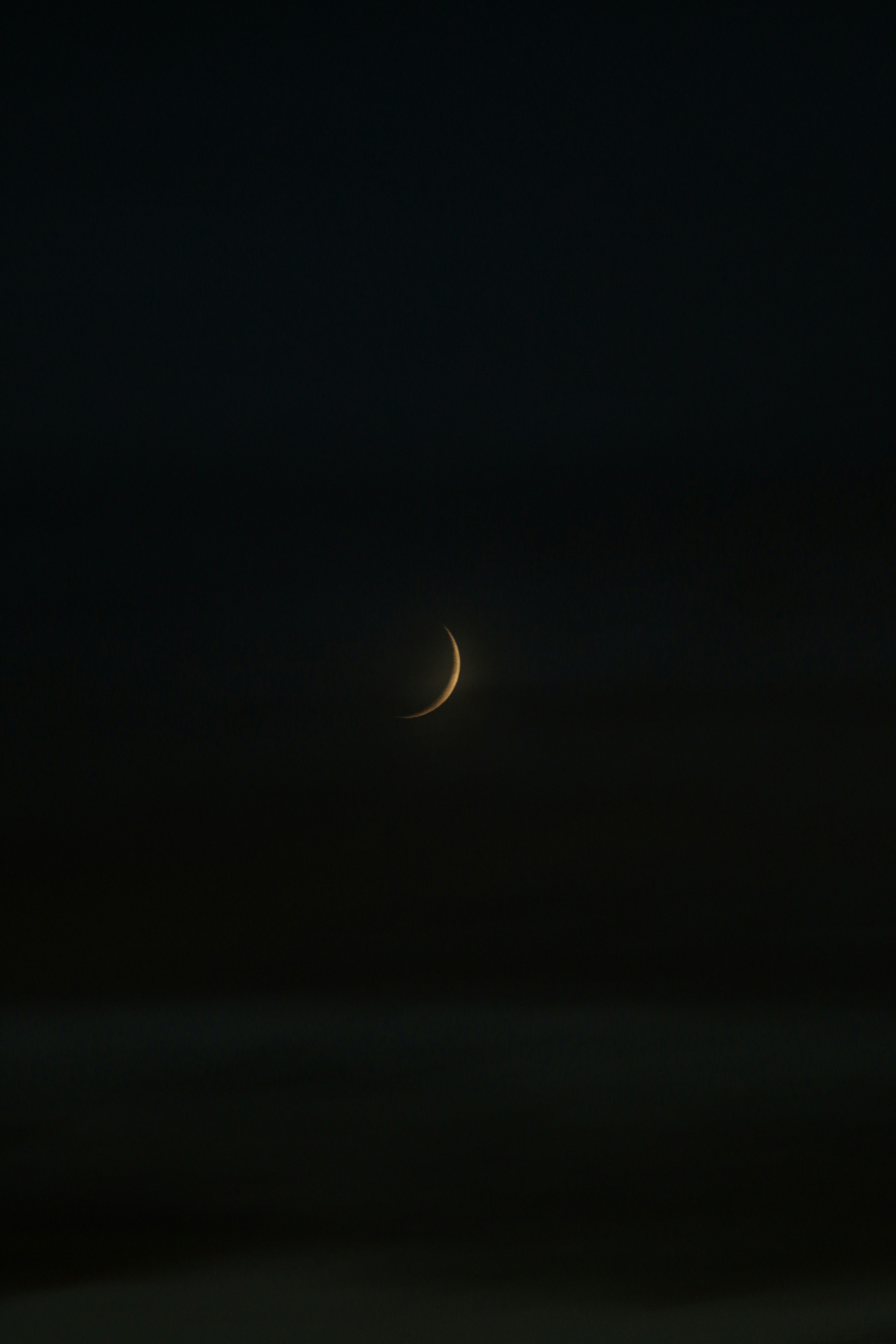 A crescent moon is seen in the night sky photo – Free Black Image on ...