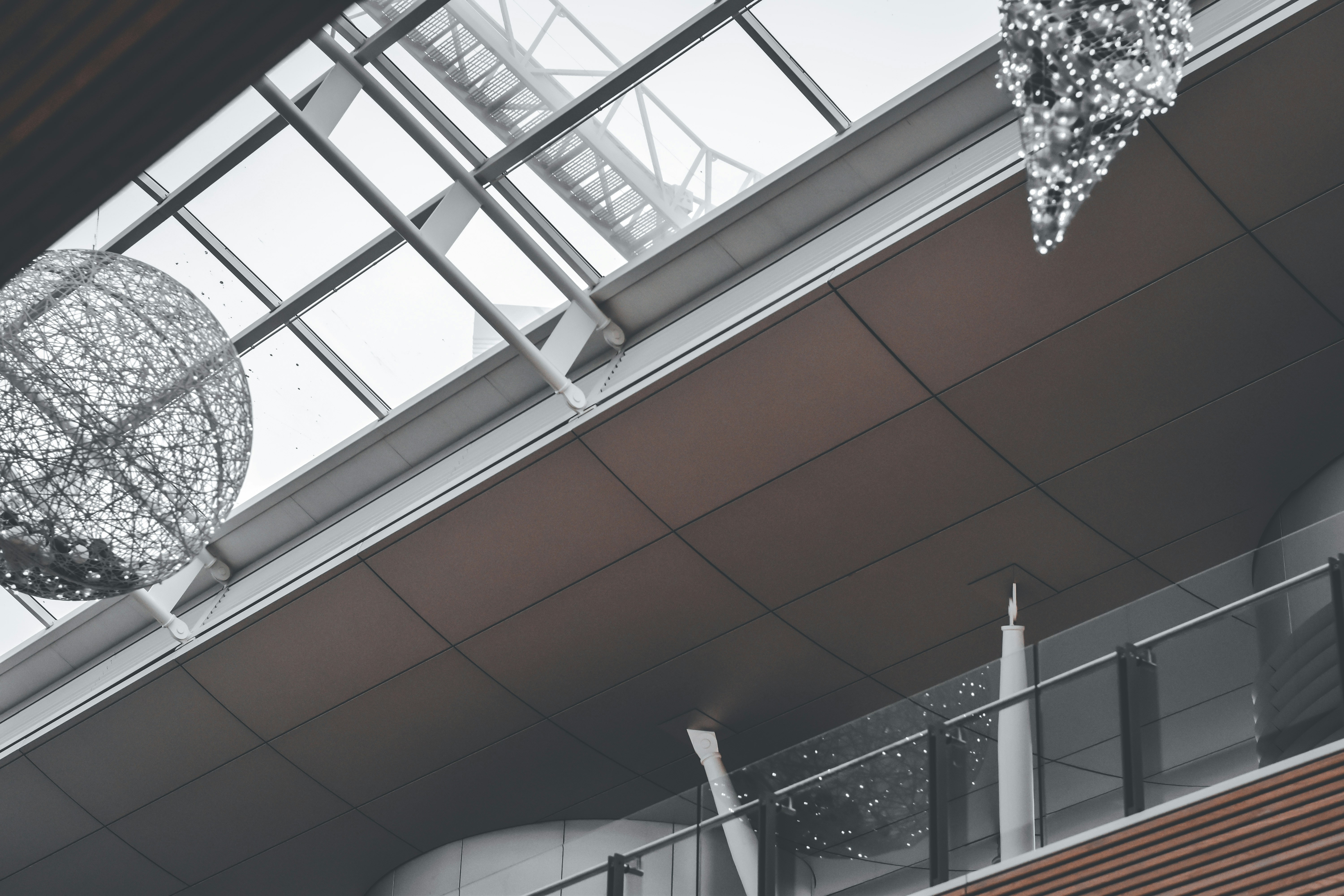 Geometric Light: Modern Atrium Geometry and Hanging Orbs