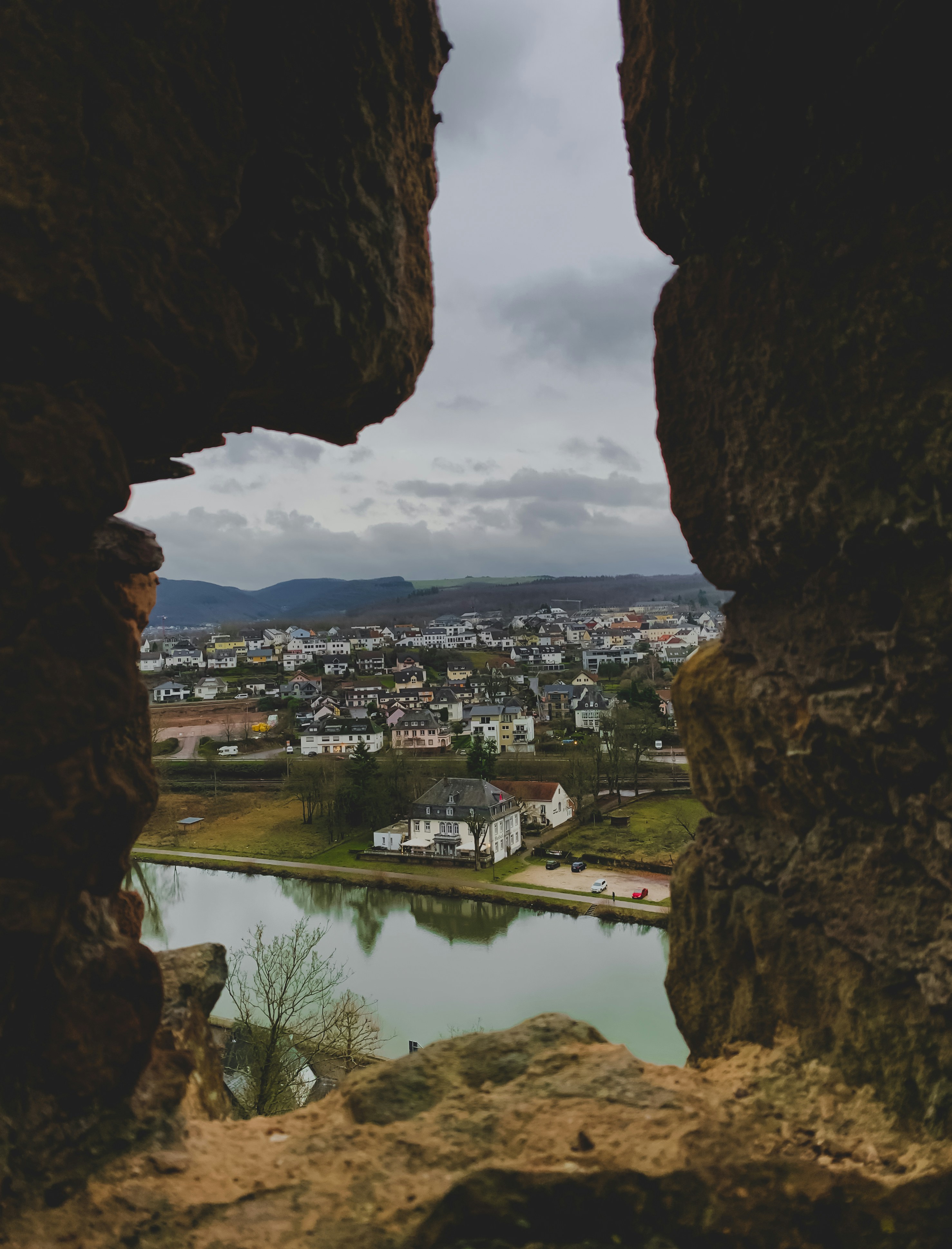 A view of a small town through a window photo – Free Landscape Image on ...