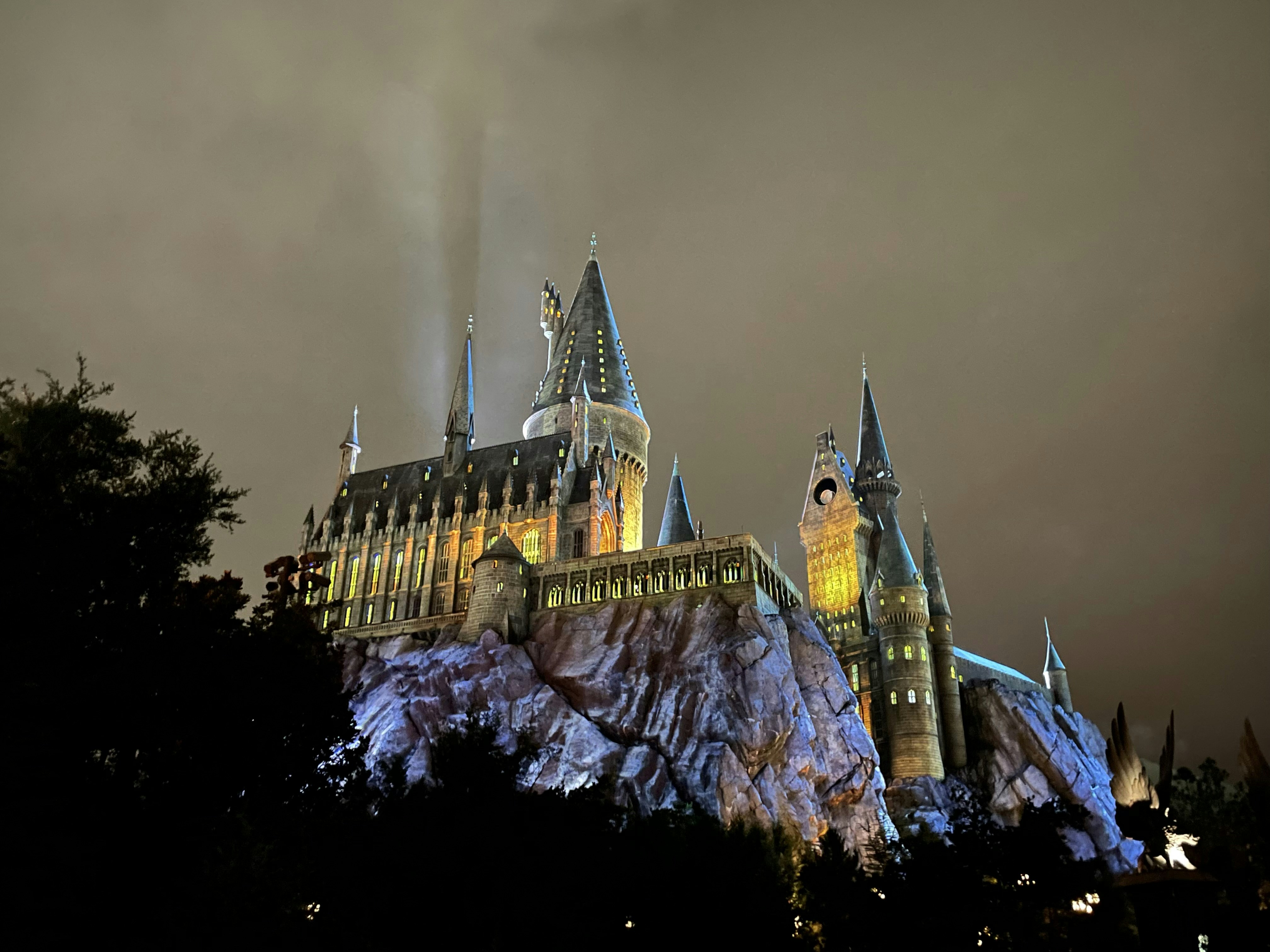 A castle lit up at night with a sky background photo – Free Building ...