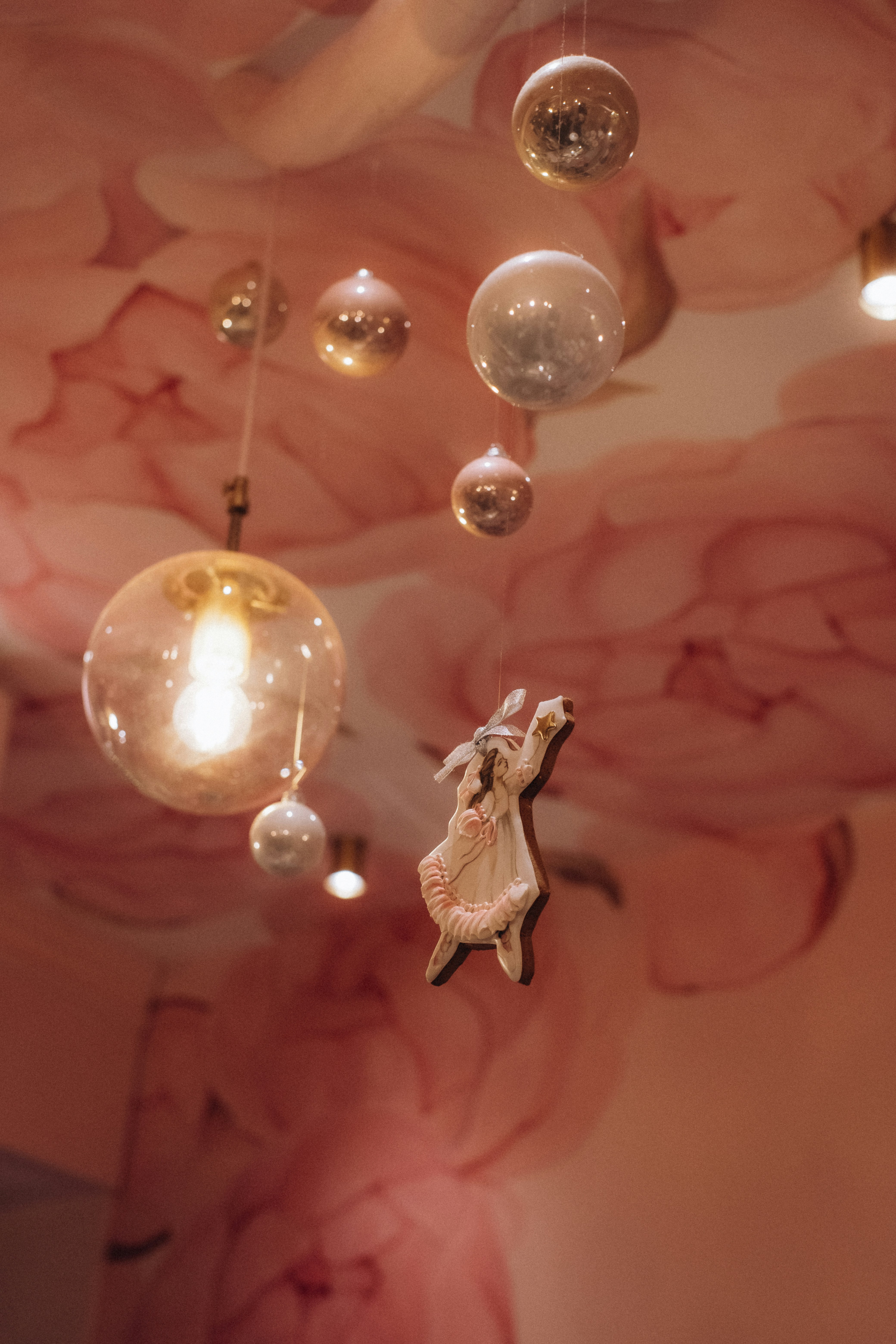 Hanging Orbs and a Falling Kitten: Whimsy in a Candy-Pink Ceiling