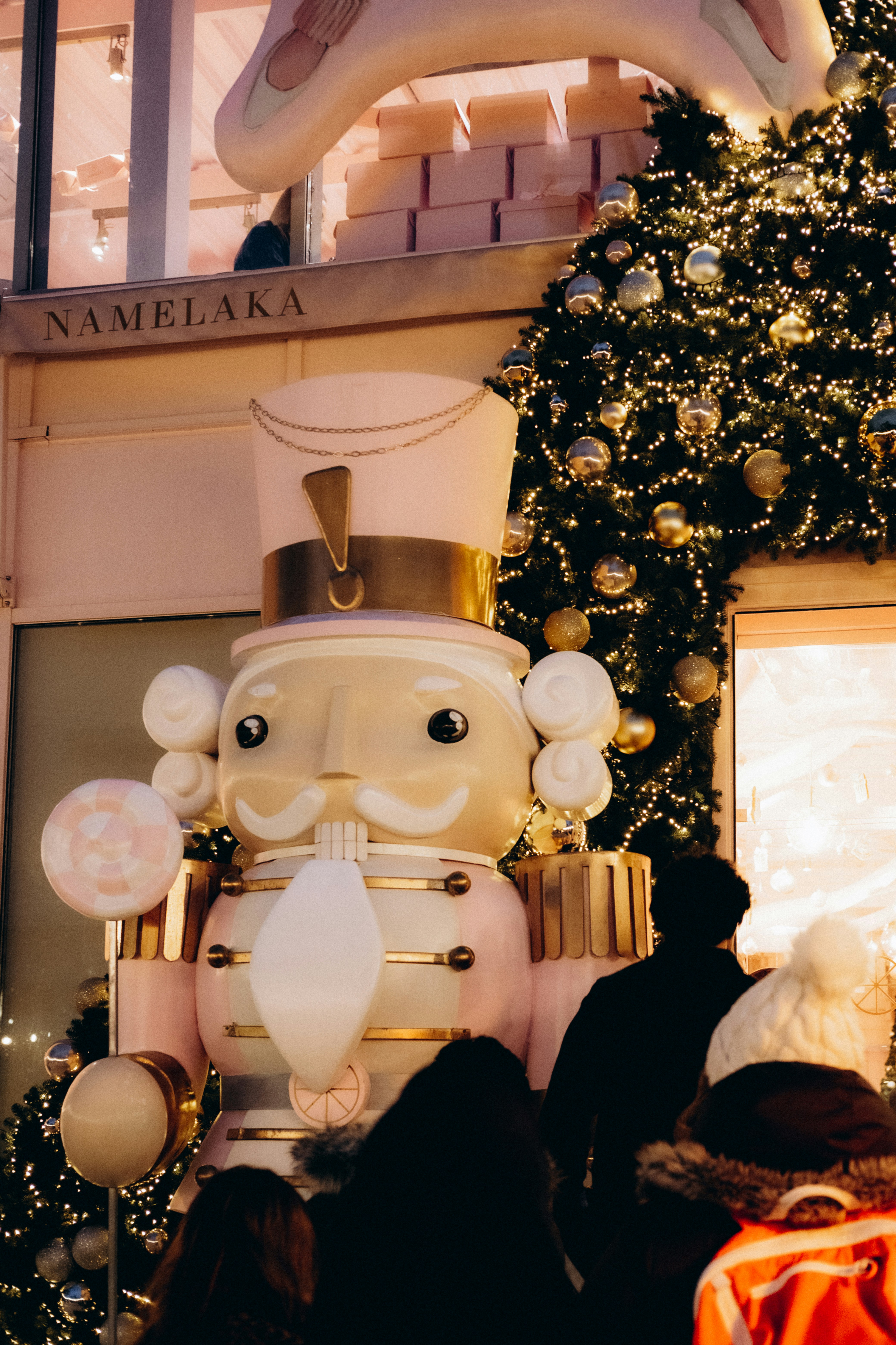 A large christmas decoration with a santa clause on top of it photo ...