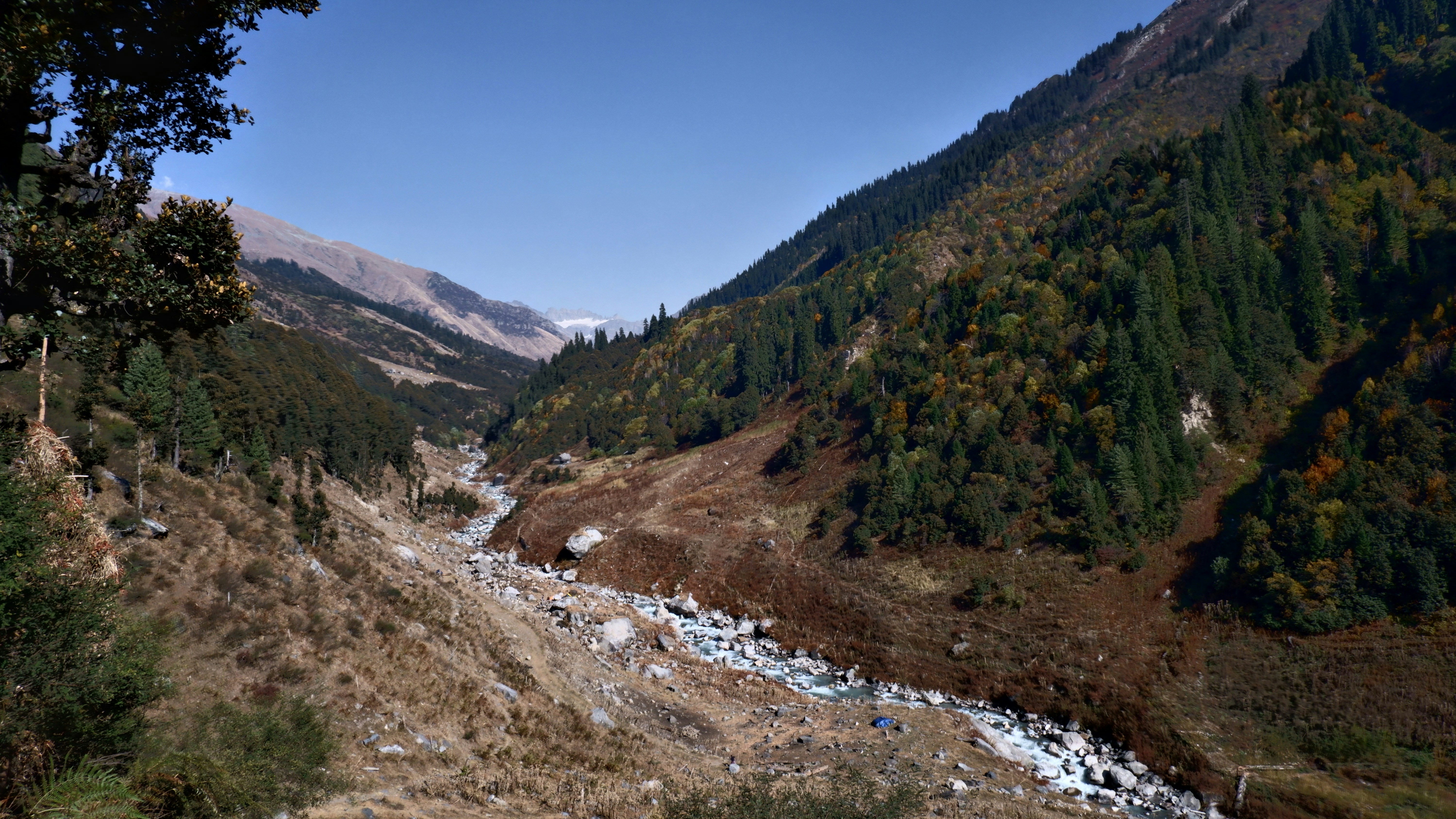 A view of a mountain valley with a river running through it photo ...
