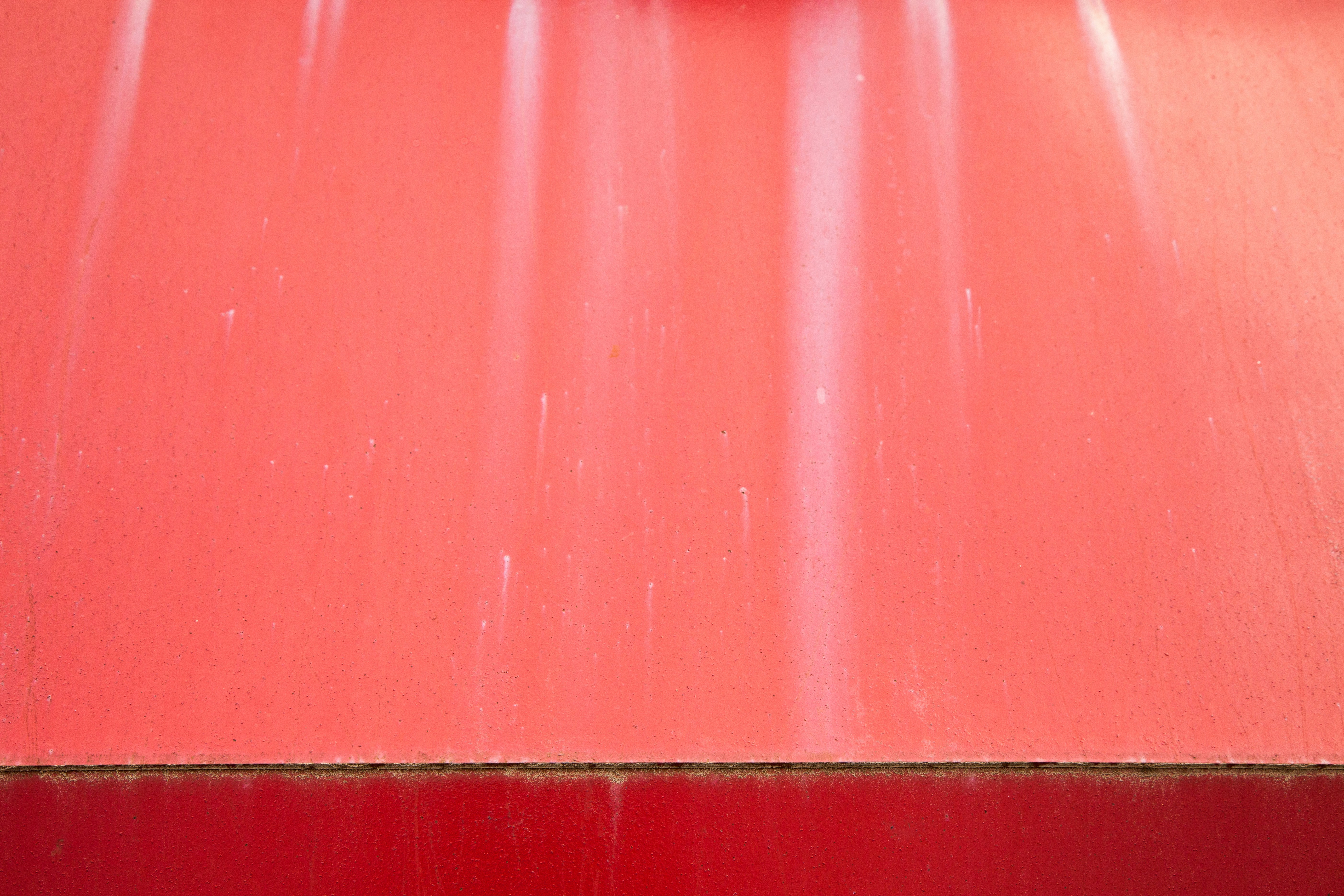 a close up of a red metal roof