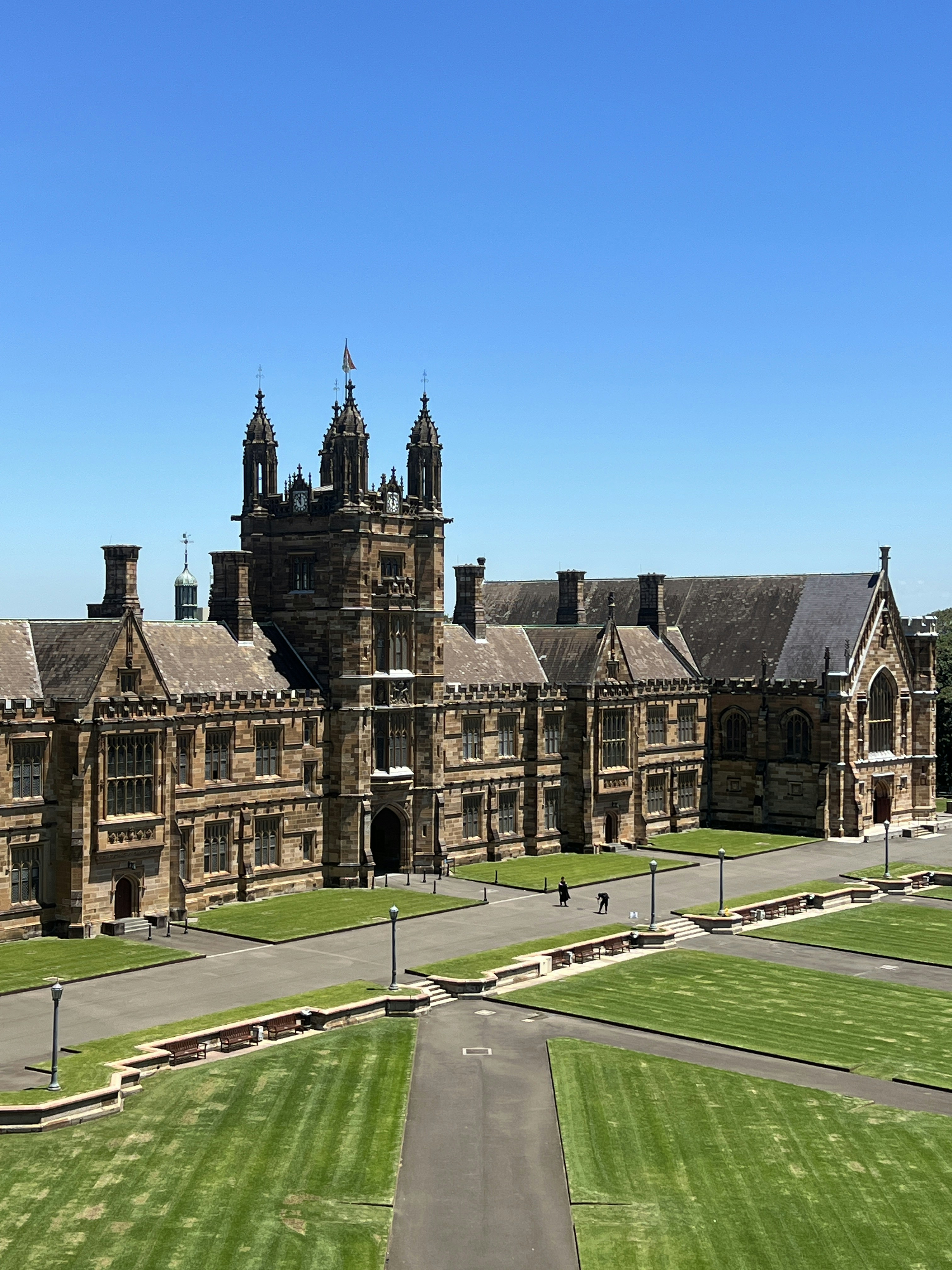 Gothic Campus Fortress under a Crisp Blue Sky