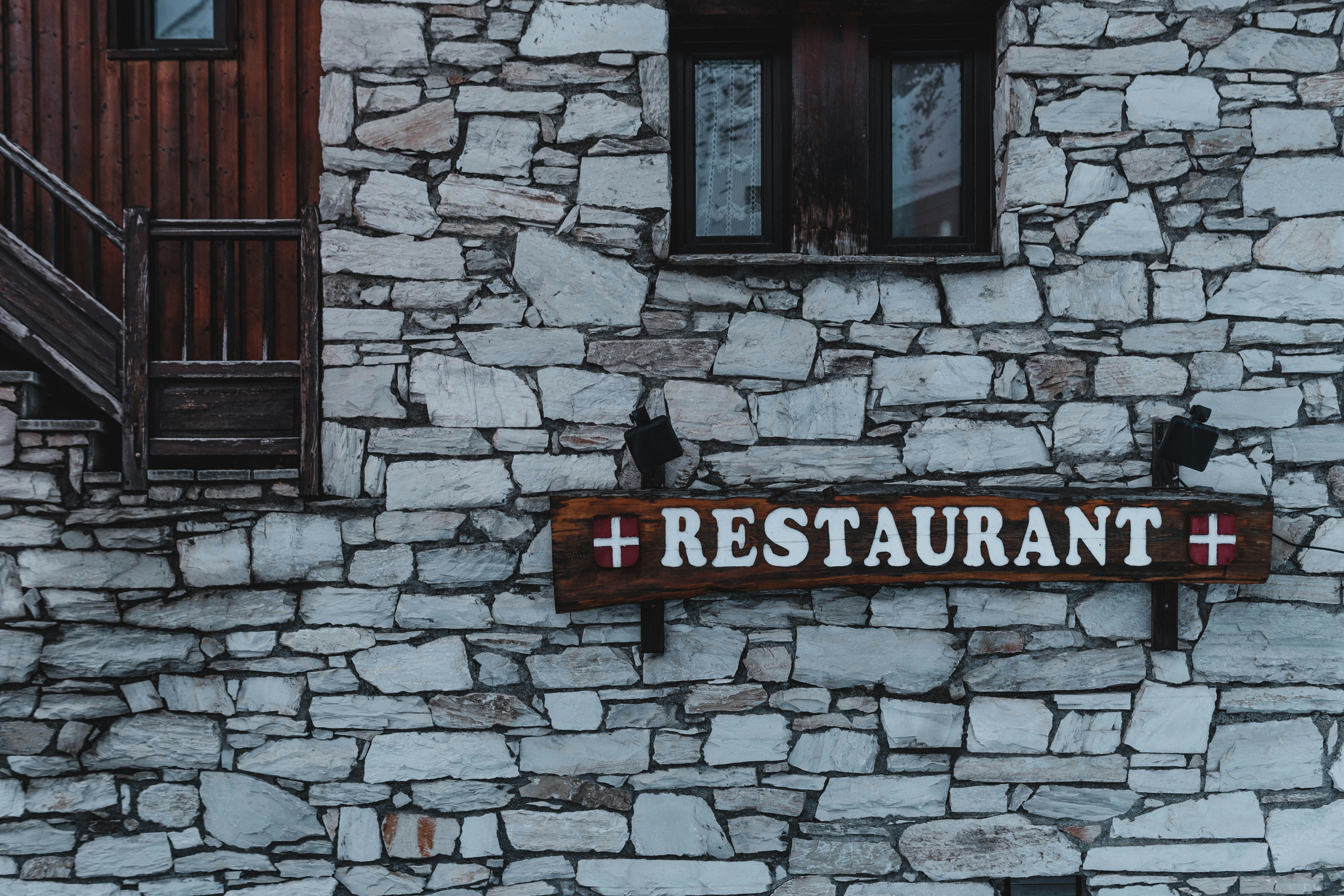 a stone building with a sign that says restaurantMatt Pictures