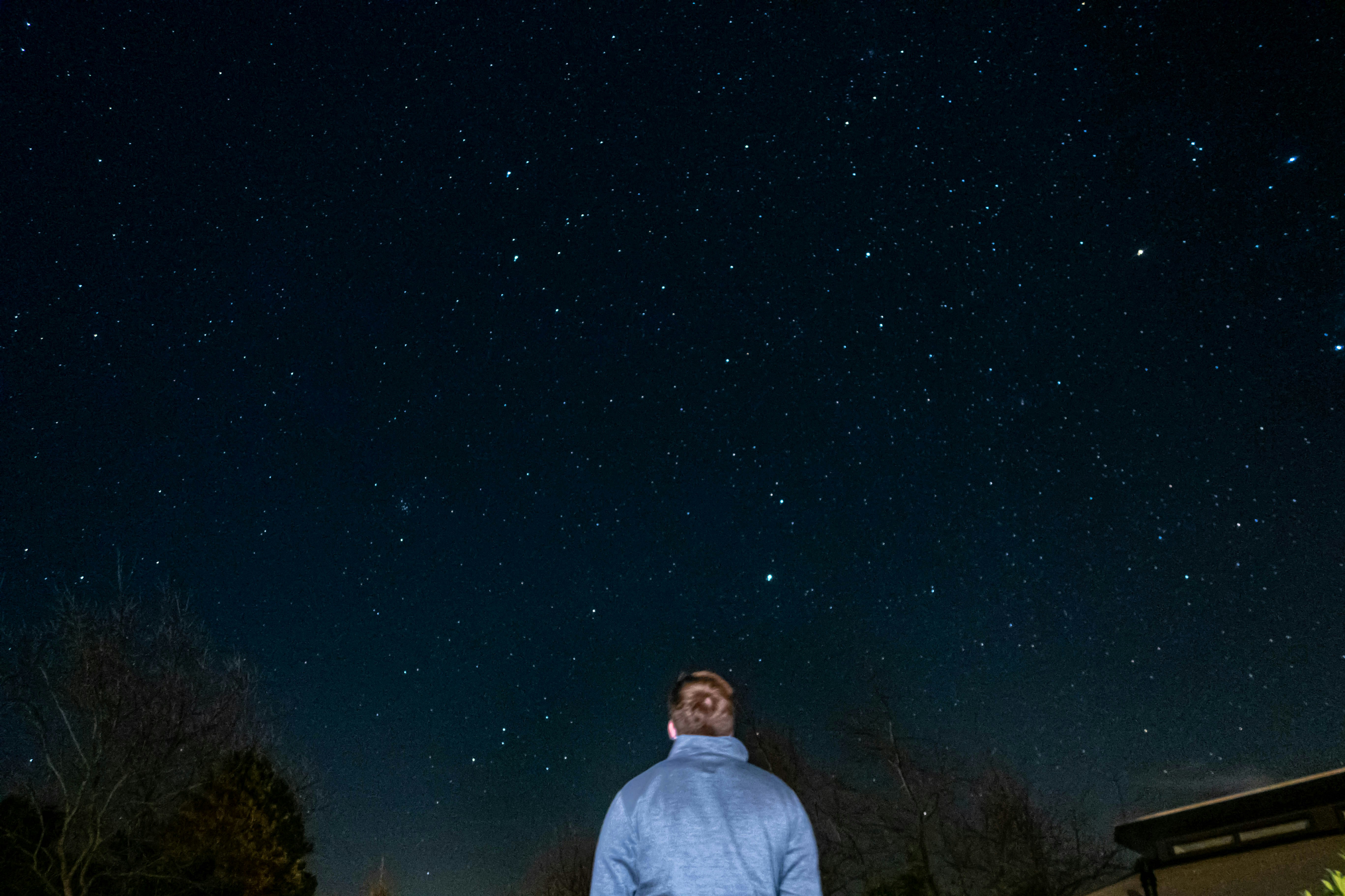 Lone Figure Under a Sea of Stars