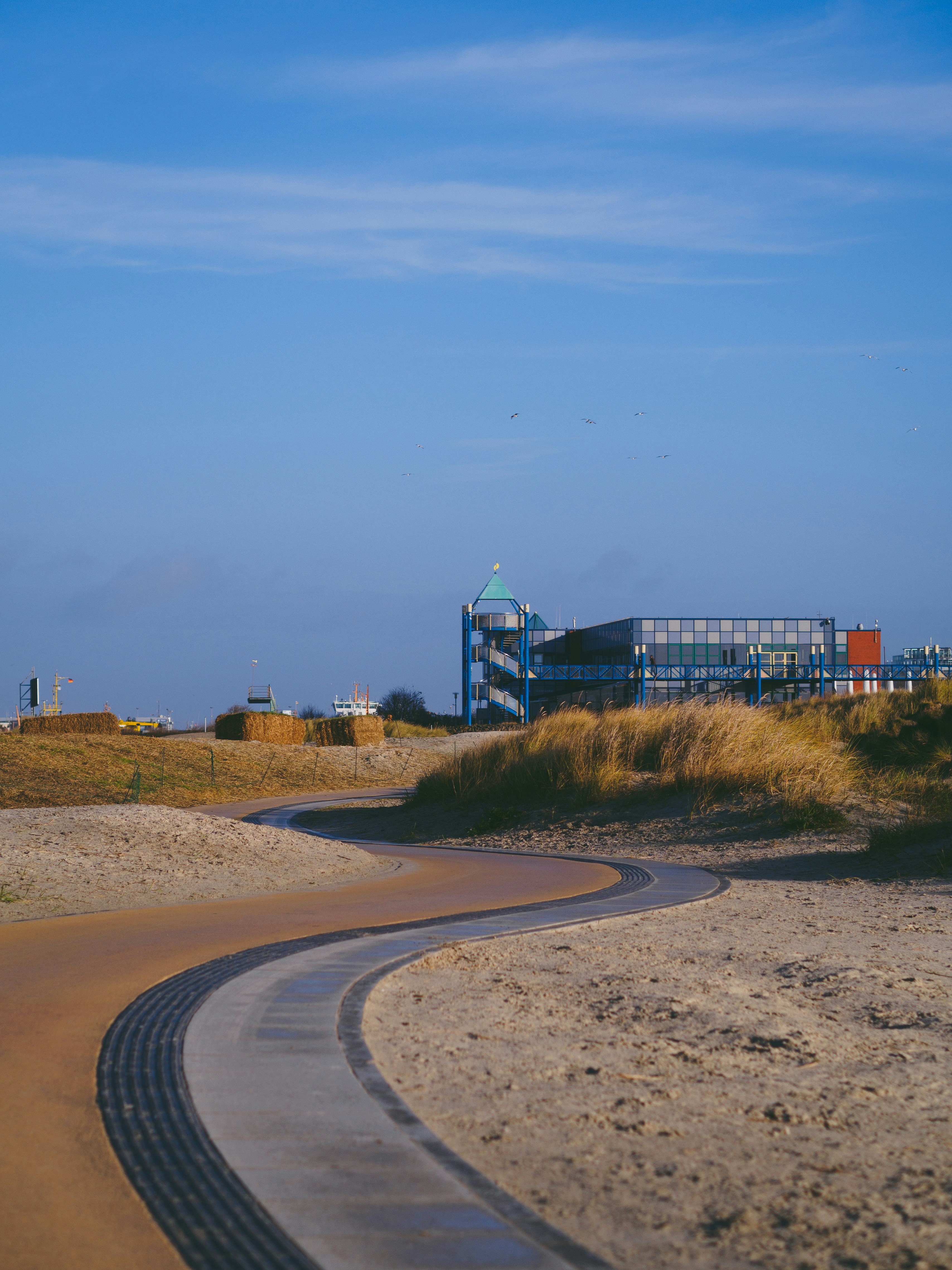 Dune Path to a Turquoise Pavilion on the Horizon