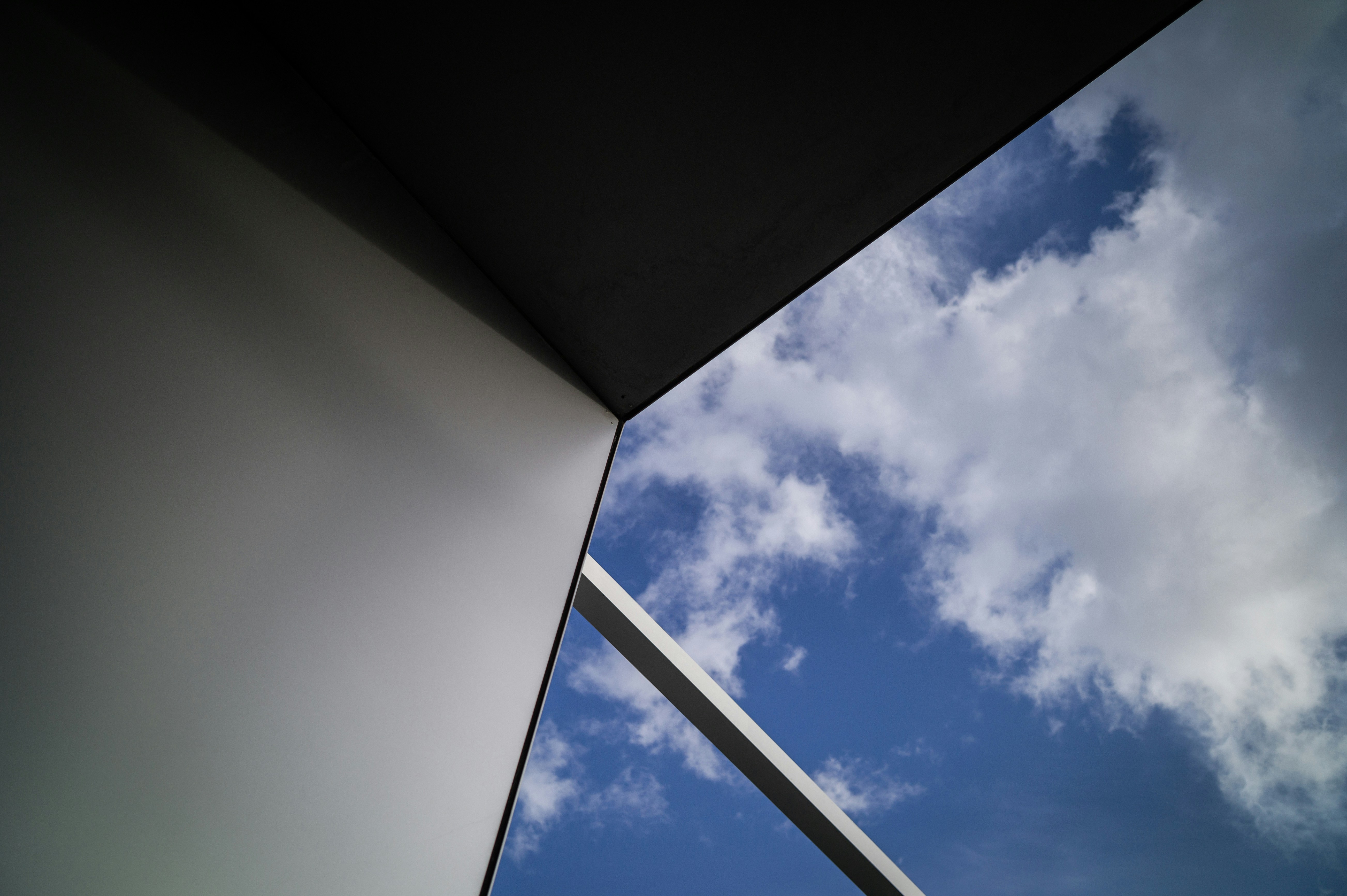 A view of the sky through a window of a building photo – Free Nature ...