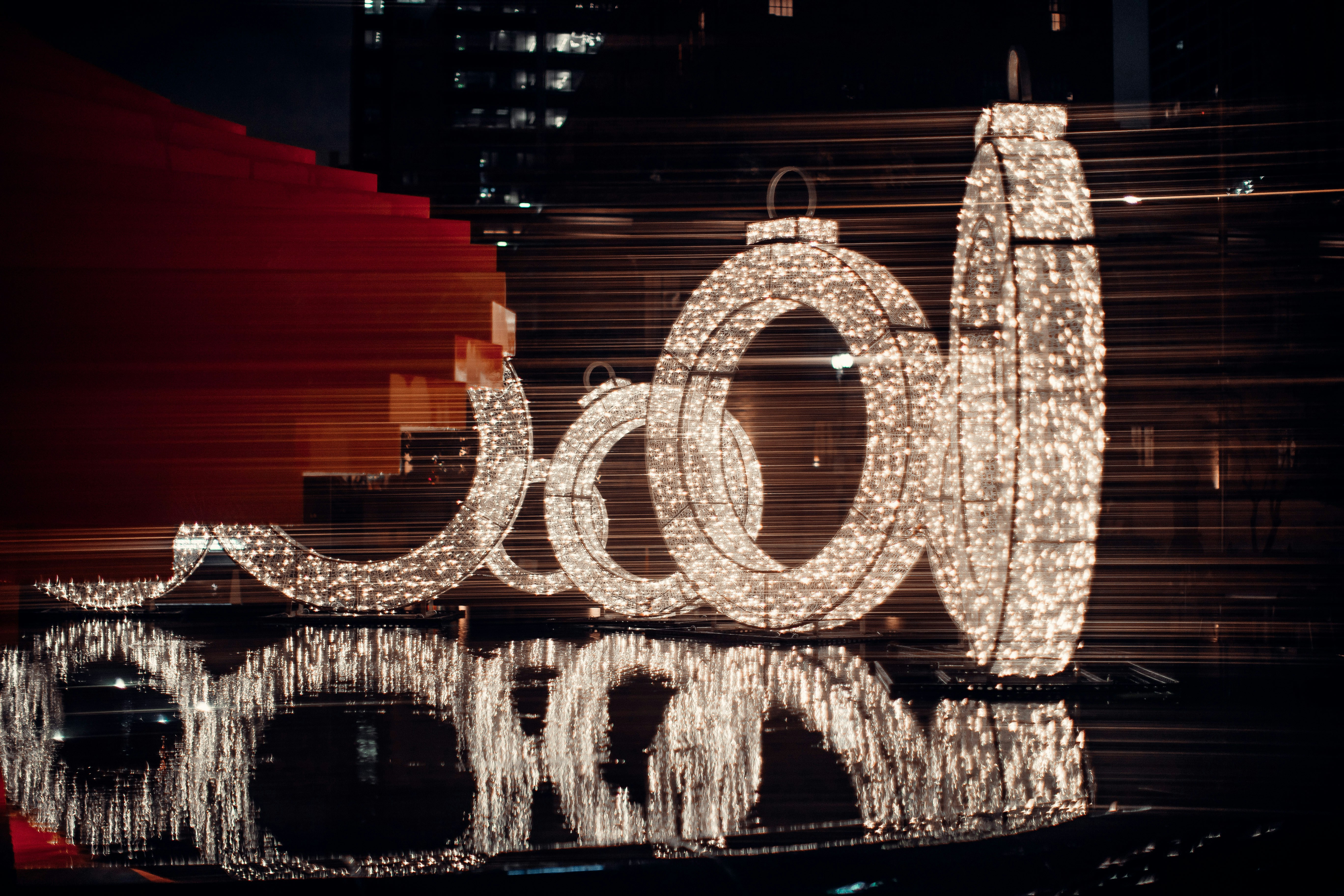 Year of Light: Glimmering 2019 Sculpture on a Rain-Slick Waterfront