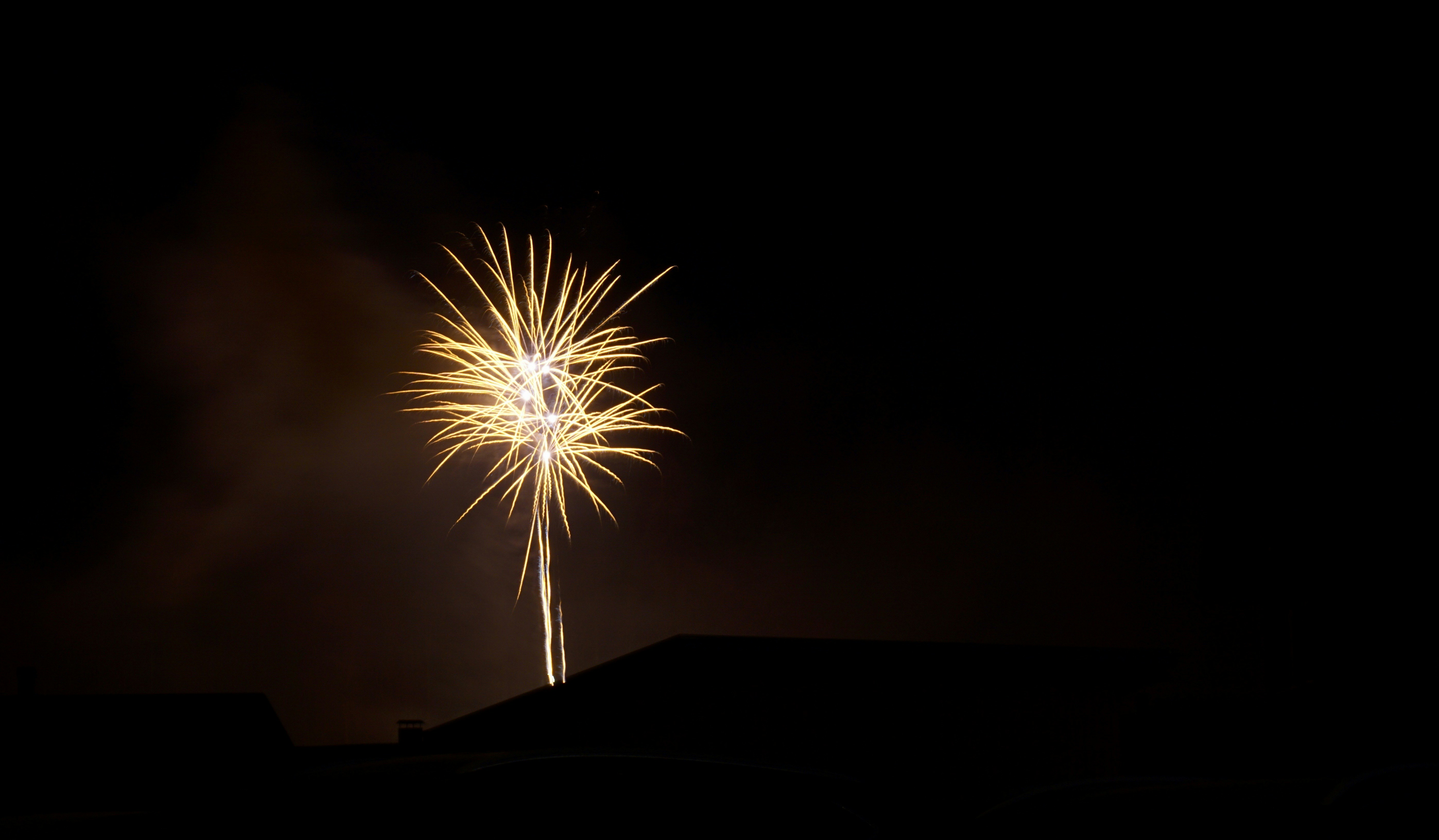 A fireworks is lit up in the night sky photo – Free Light painting ...