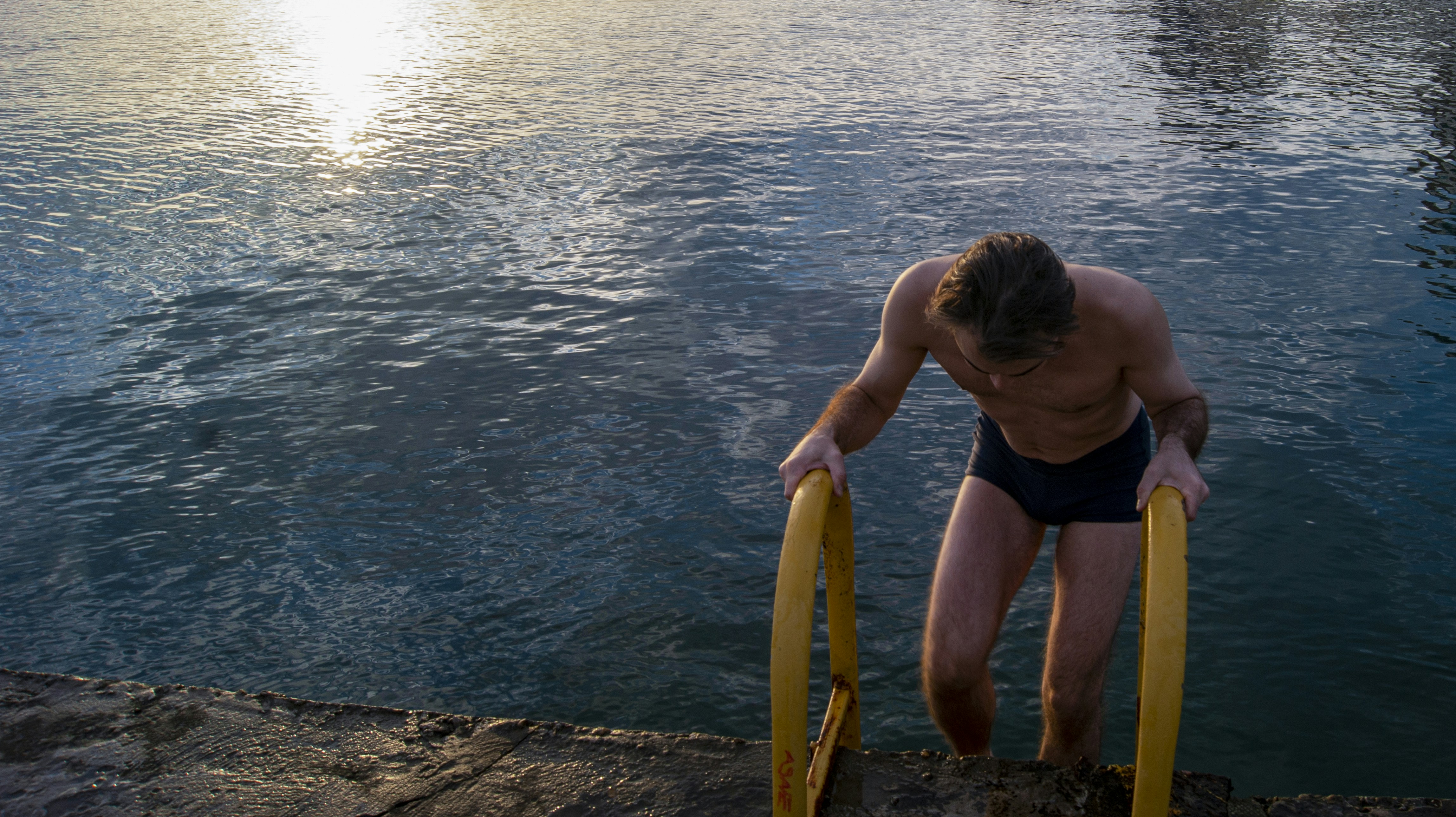 Climb into the Blue: A Sunlit Moment by the Yellow Rails