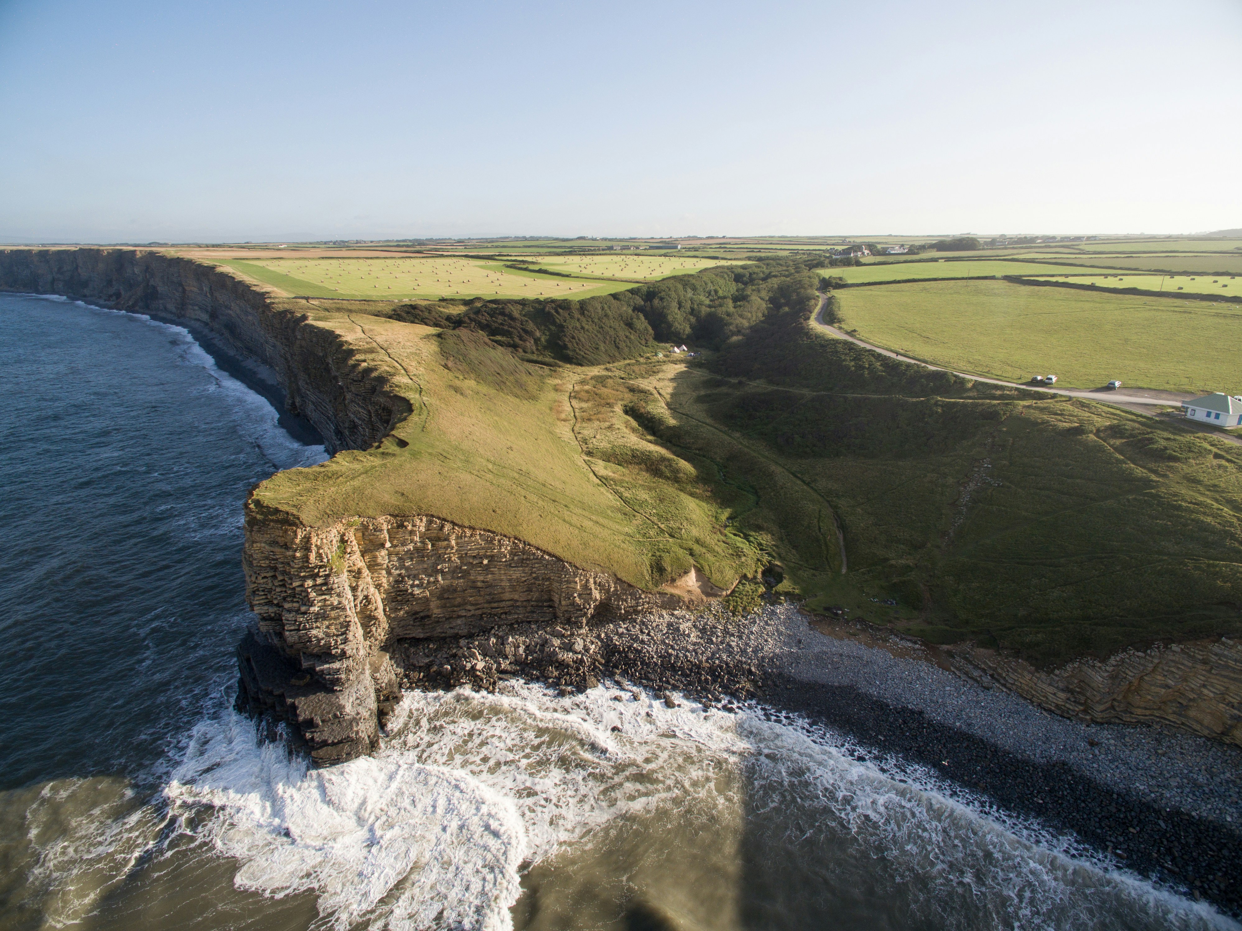 An aerial view of a large body of water photo – Free Nash point Image ...