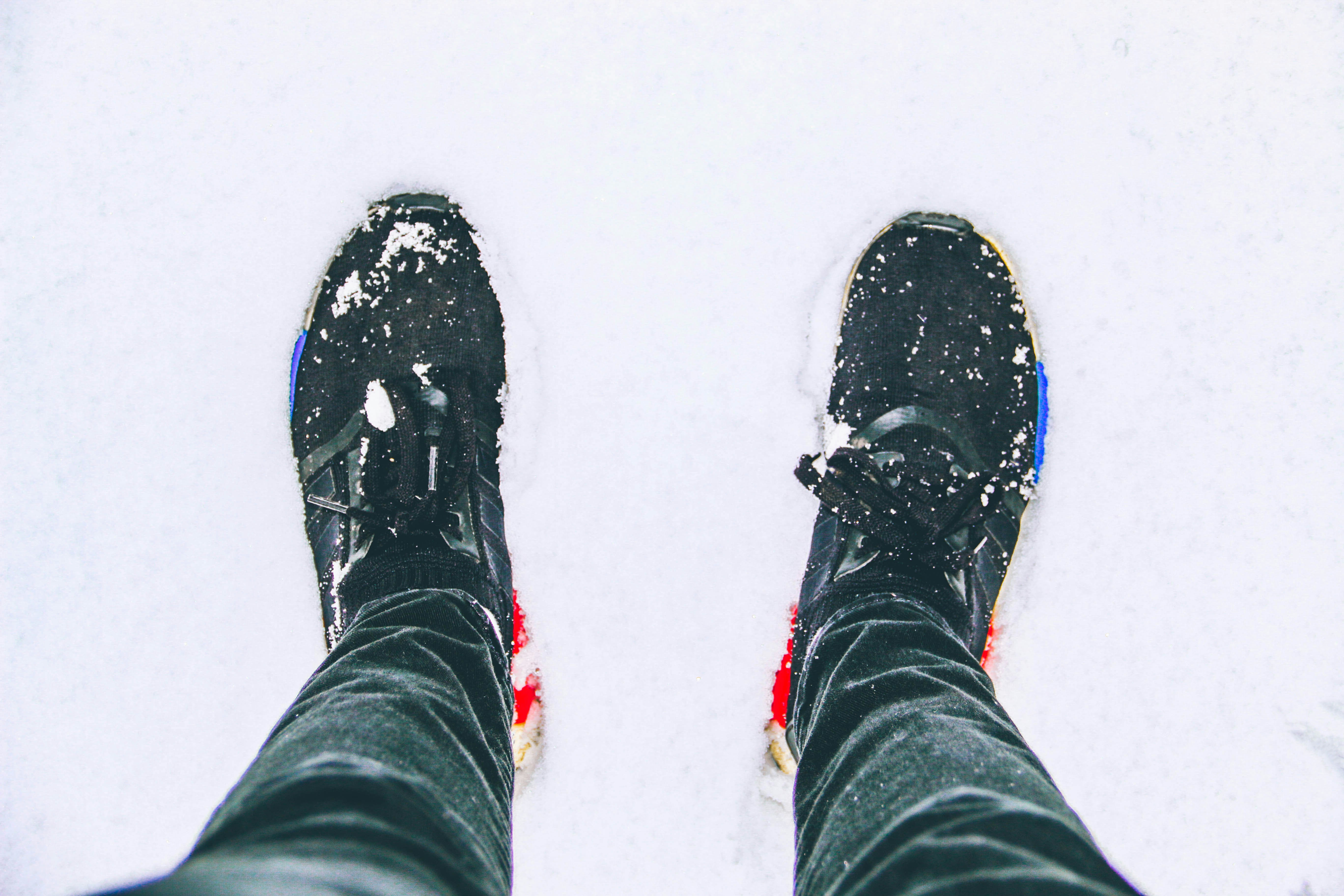 Boots on Fresh Snow: A Top-Down Portrait of Winter Footwear