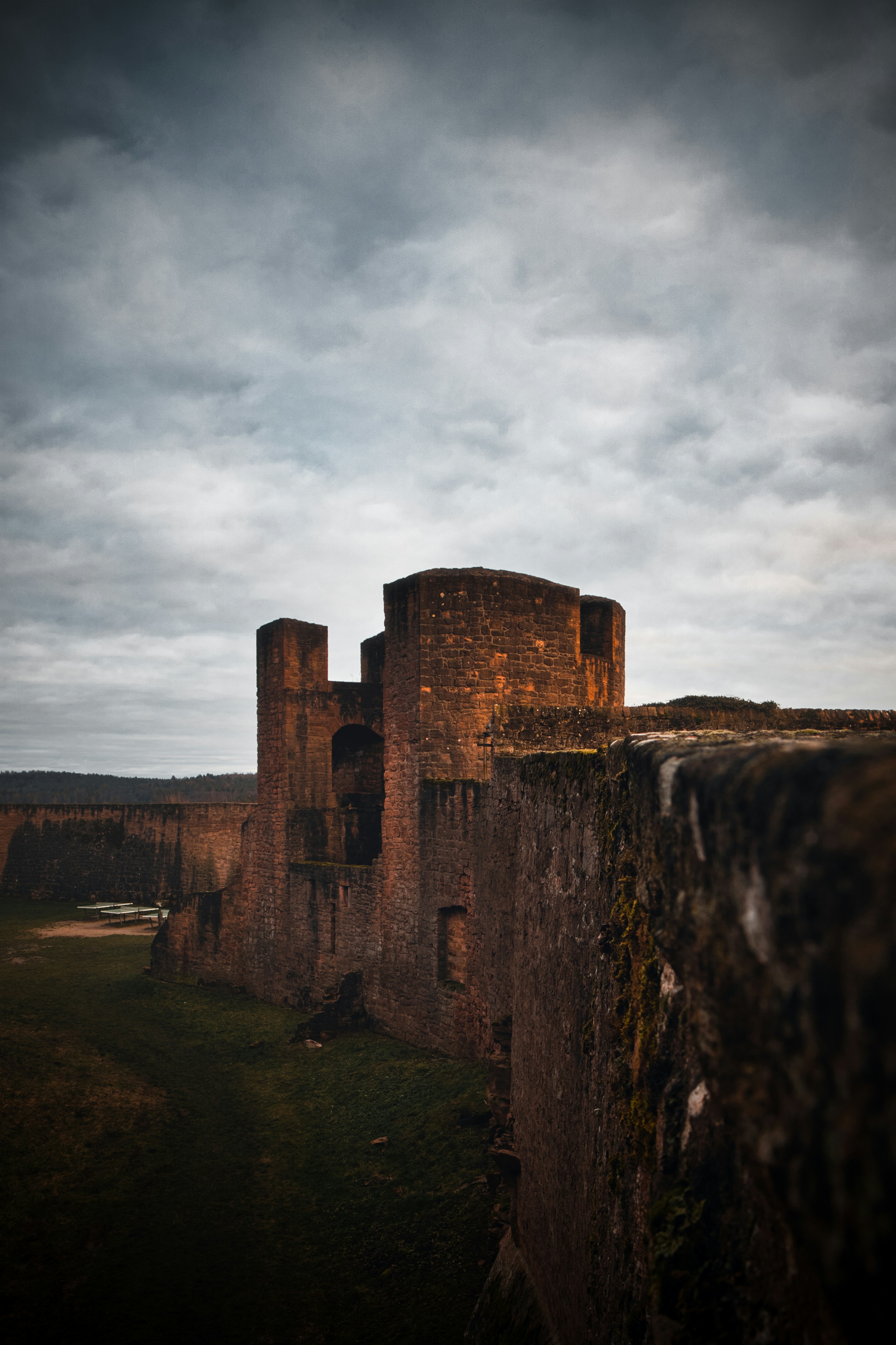 a castle with a cloudy sky in the background