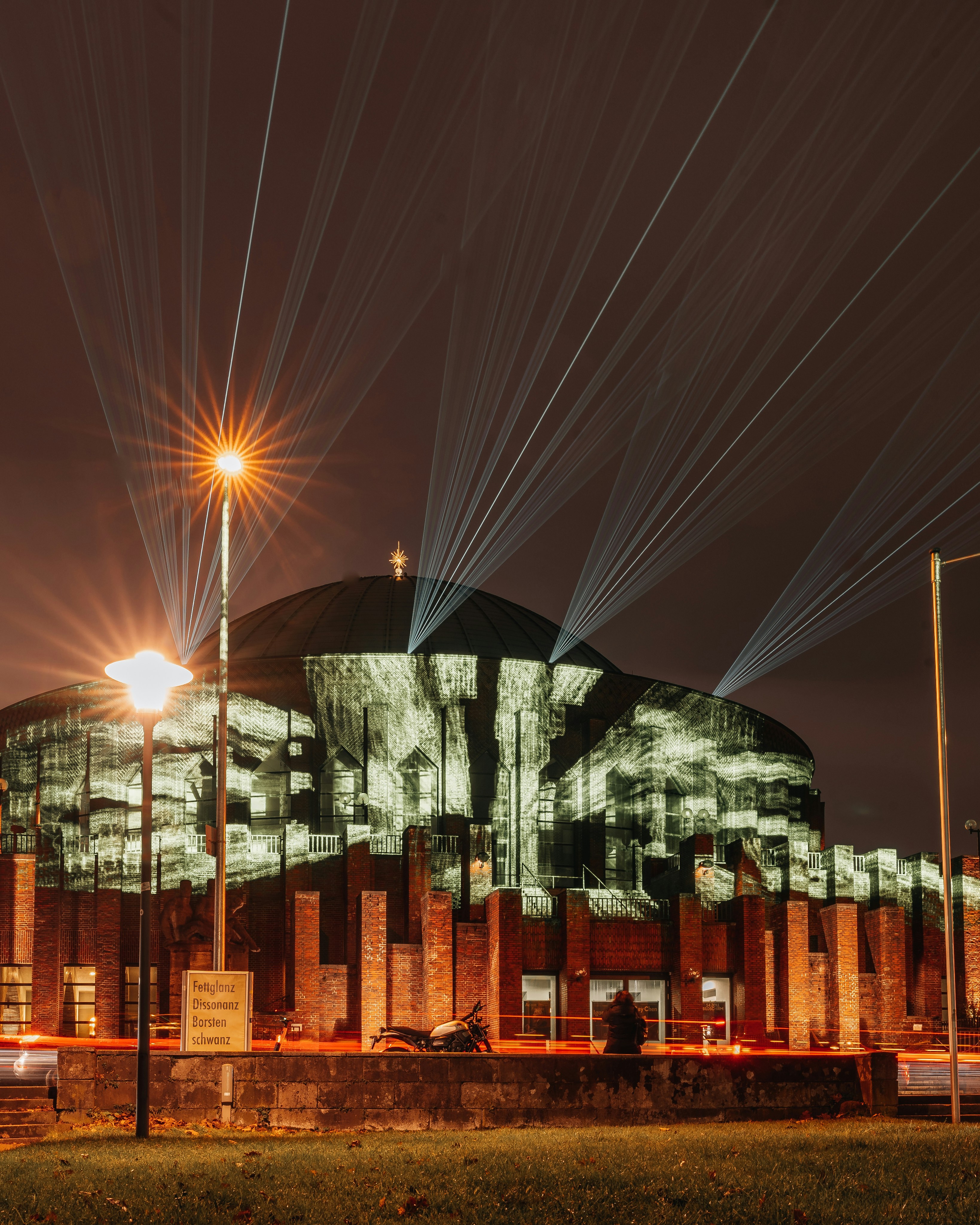 A large building lit up with lights at night photo – Free Image on Unsplash