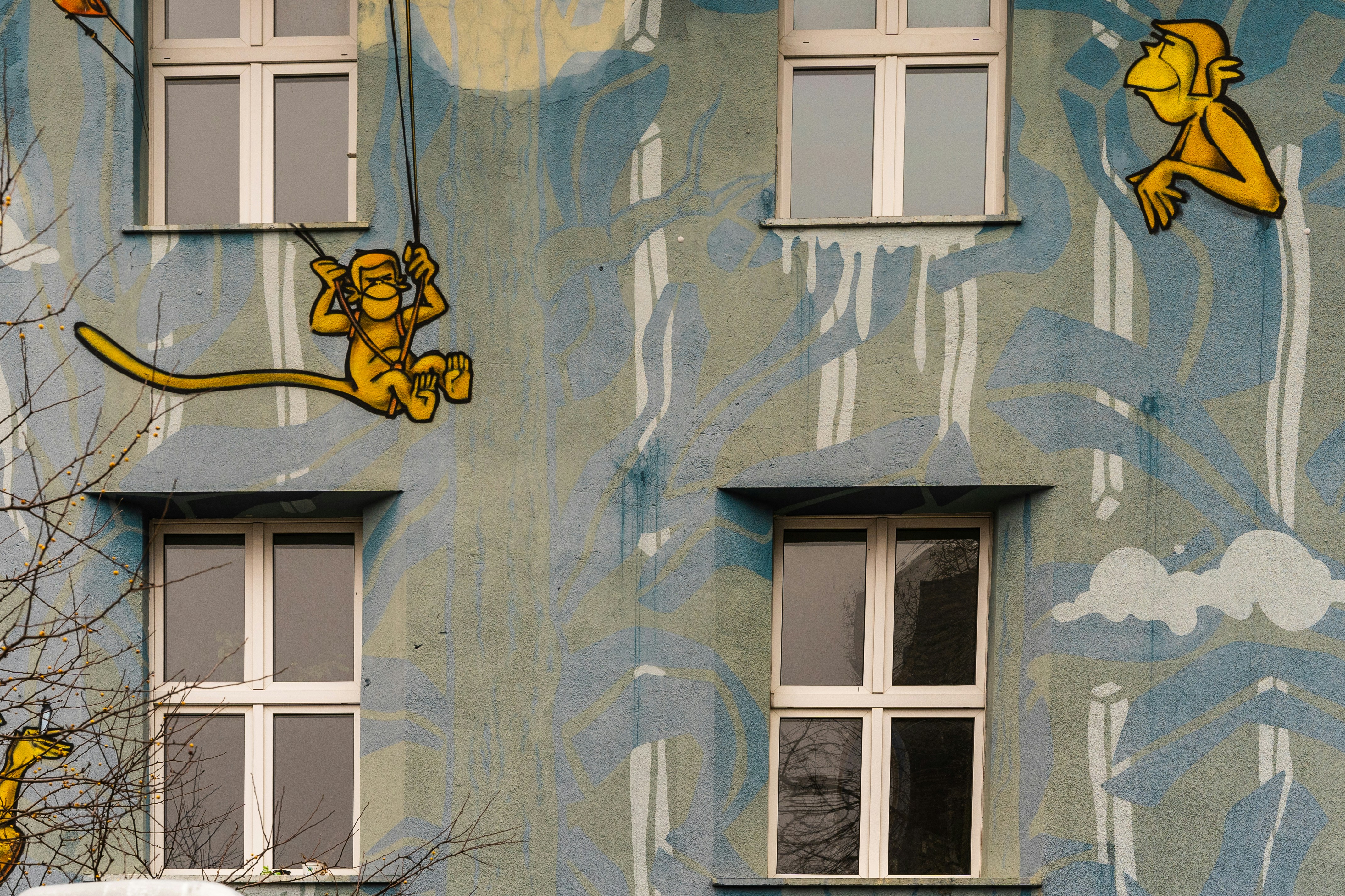Monkeys at Play: Murals Adorning a Blue City Facade
