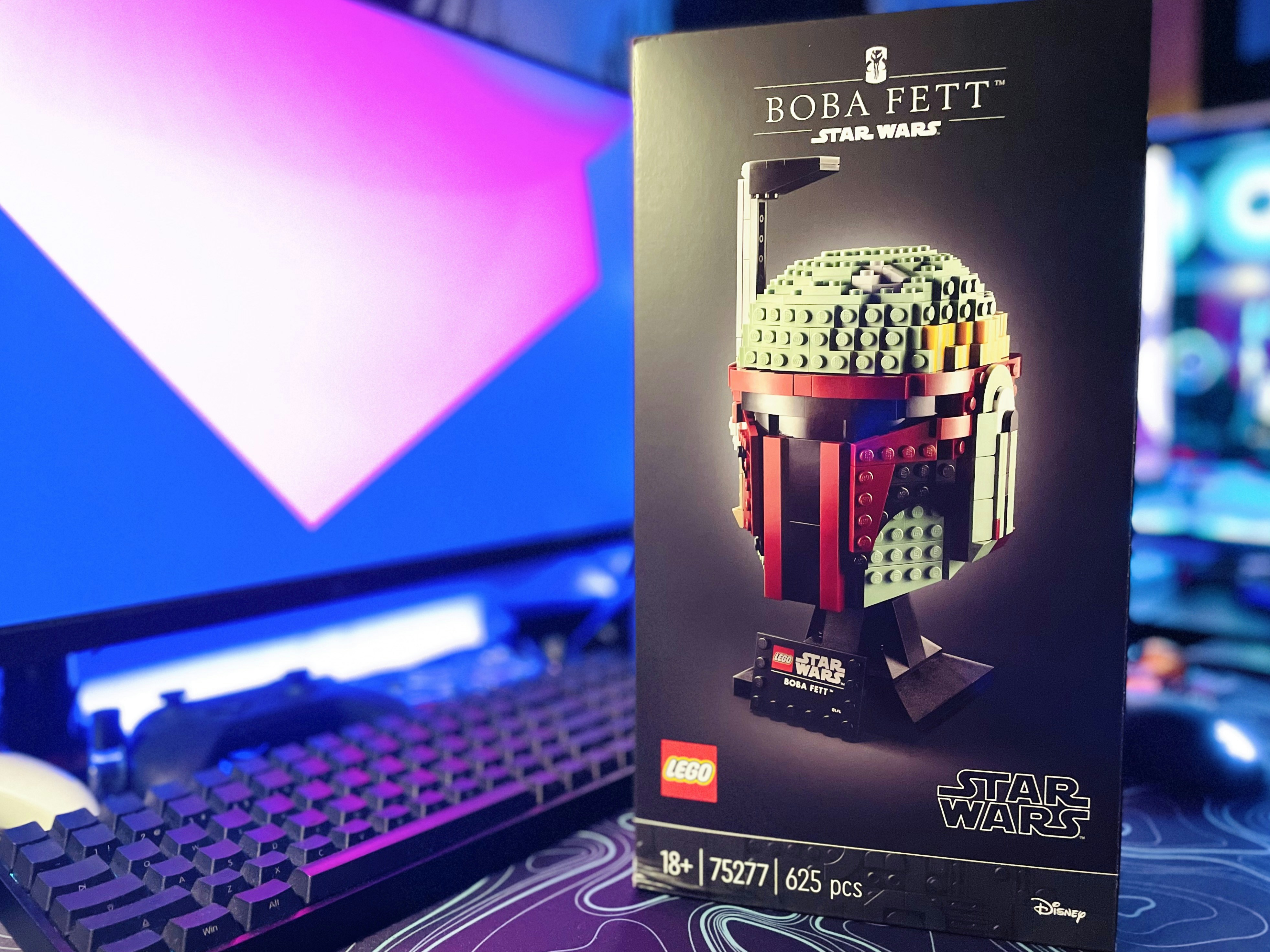 A box of lego star wars siting next to a computer photo – Free ...